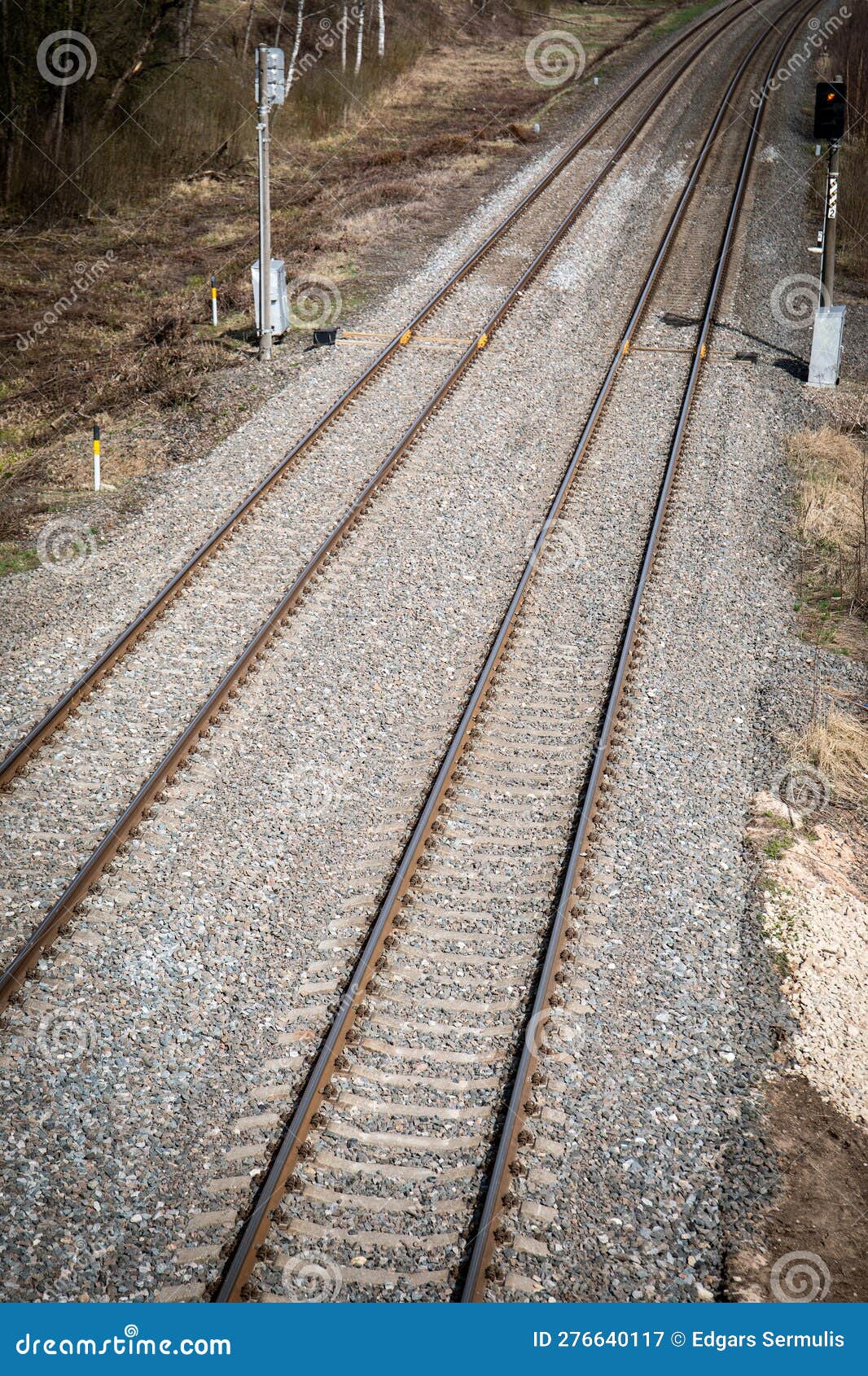 Two Sets of Railroad Tracks Run Straight and Parallel and Two Traffic ...