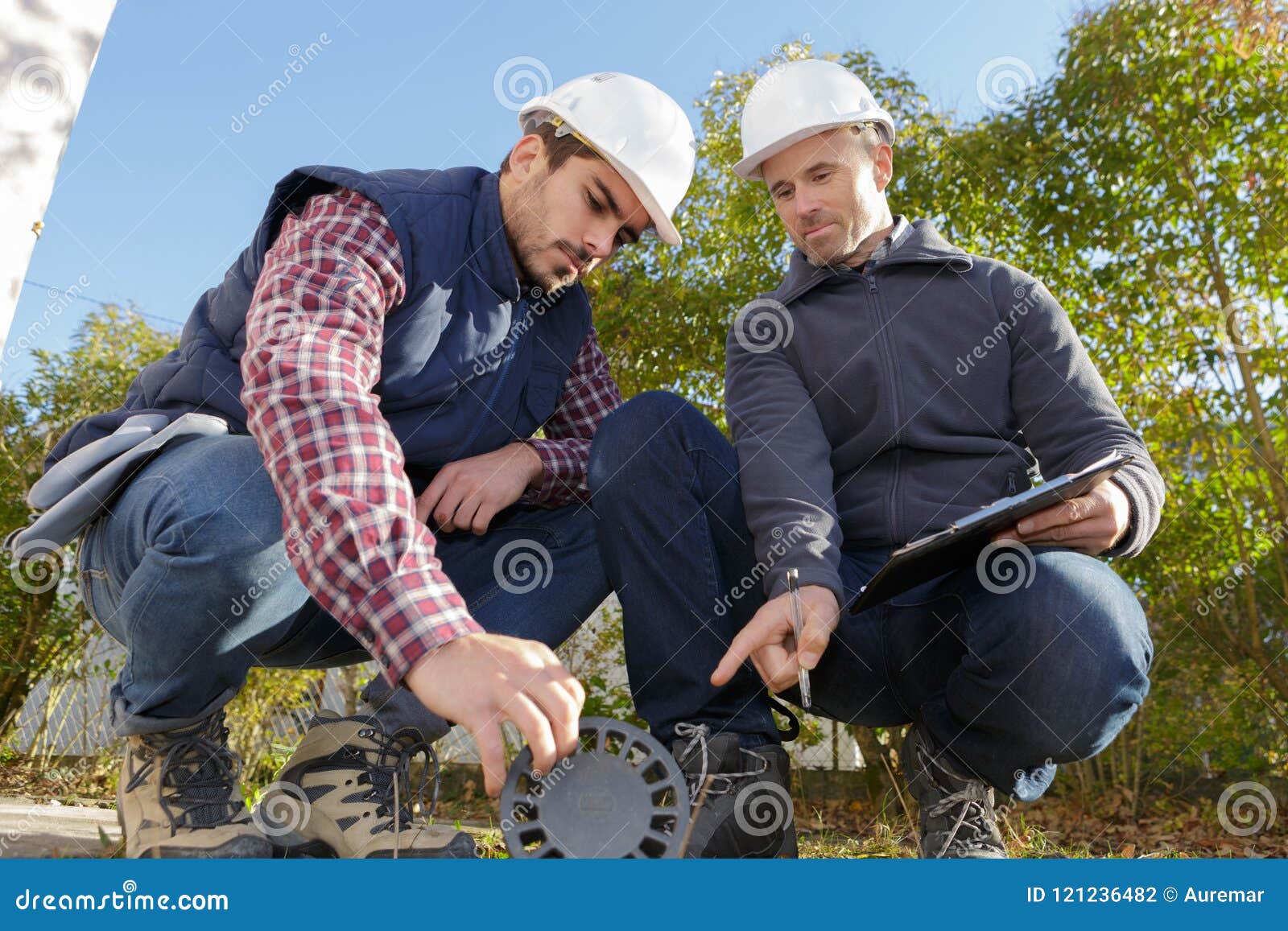 Two Sewerage Workers Inspecting Sewer Stock Photo - Image of hole ...