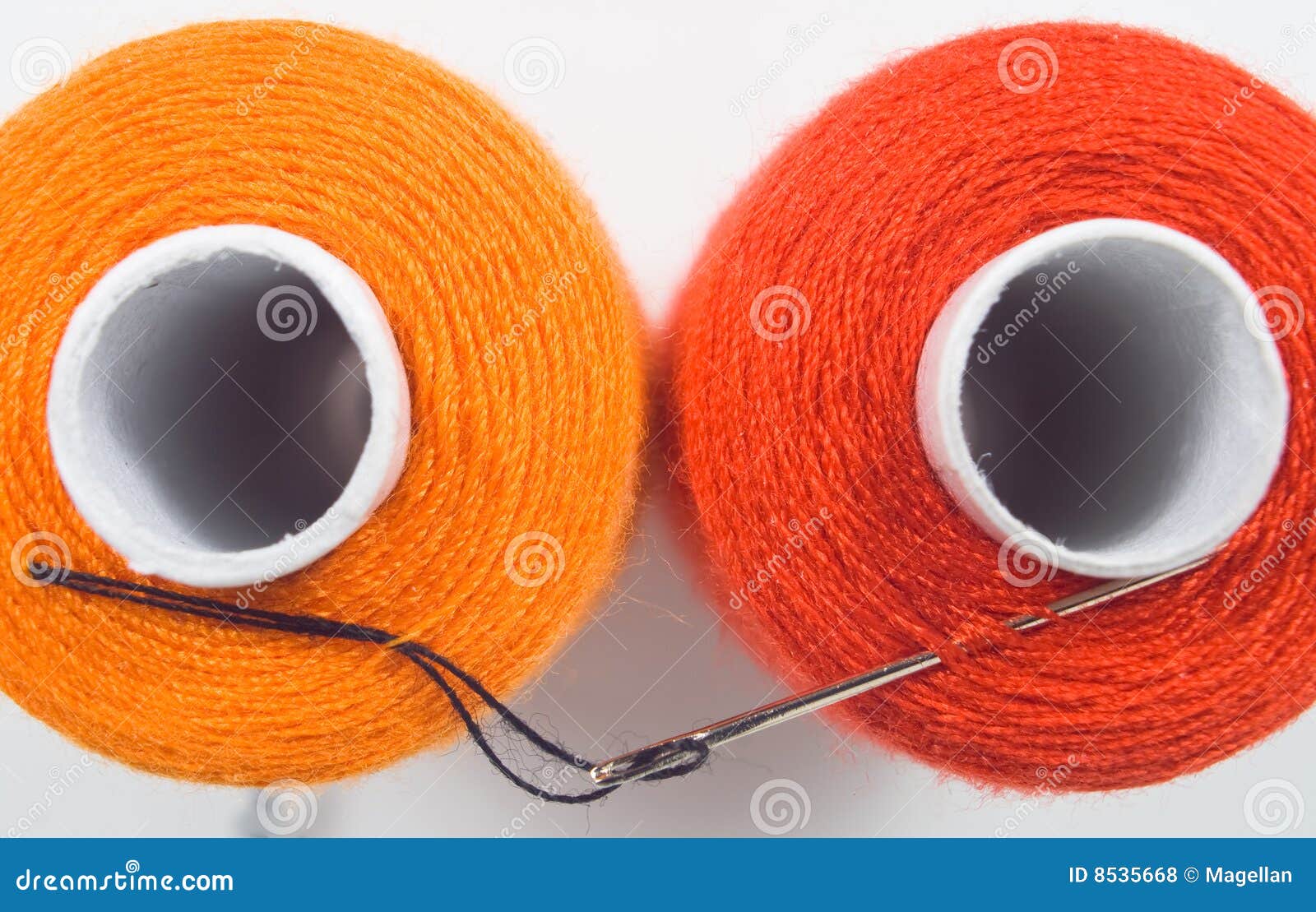 Two Sewing Spools with a Needle Stock Photo - Image of white, sewing ...