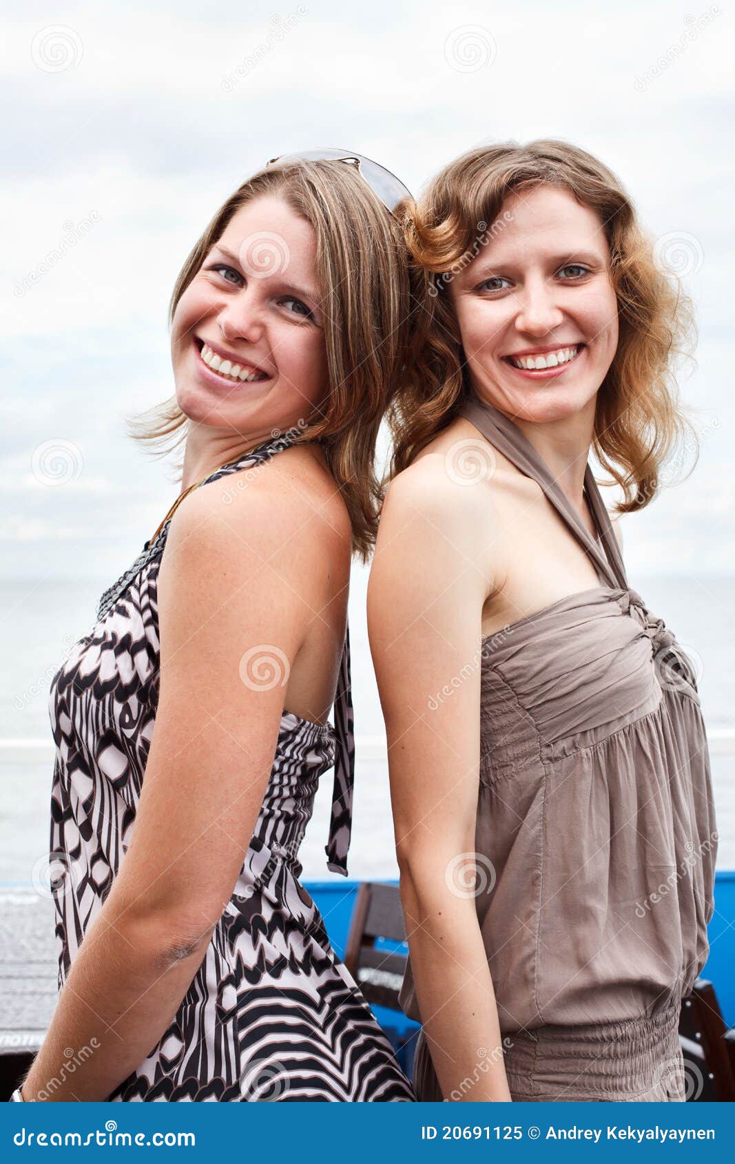 Two Girl Standing Back To Back Stock Image - Image of smiles ...