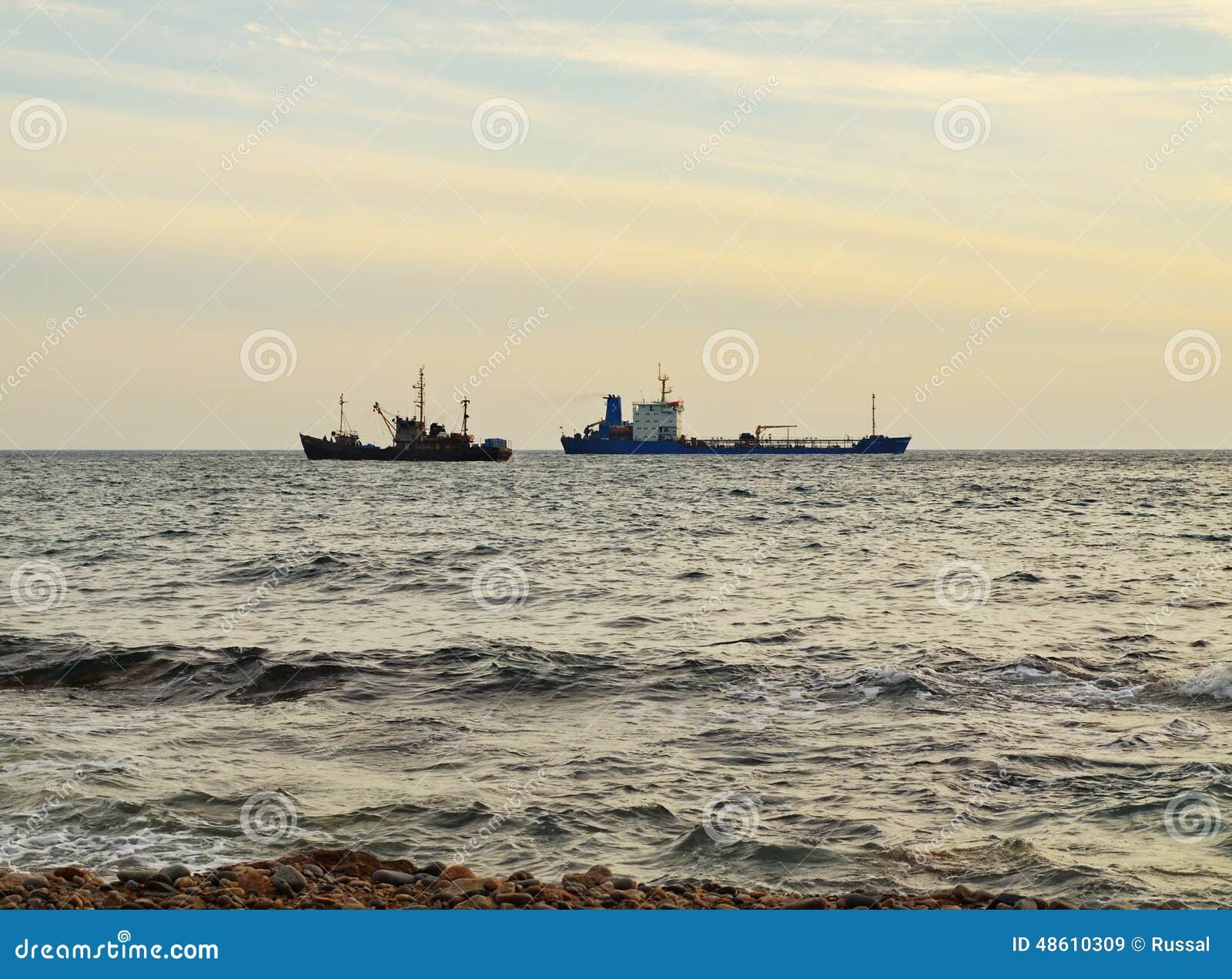 Two ships apart in sea stock image. Image of dark, dusk - 48610309