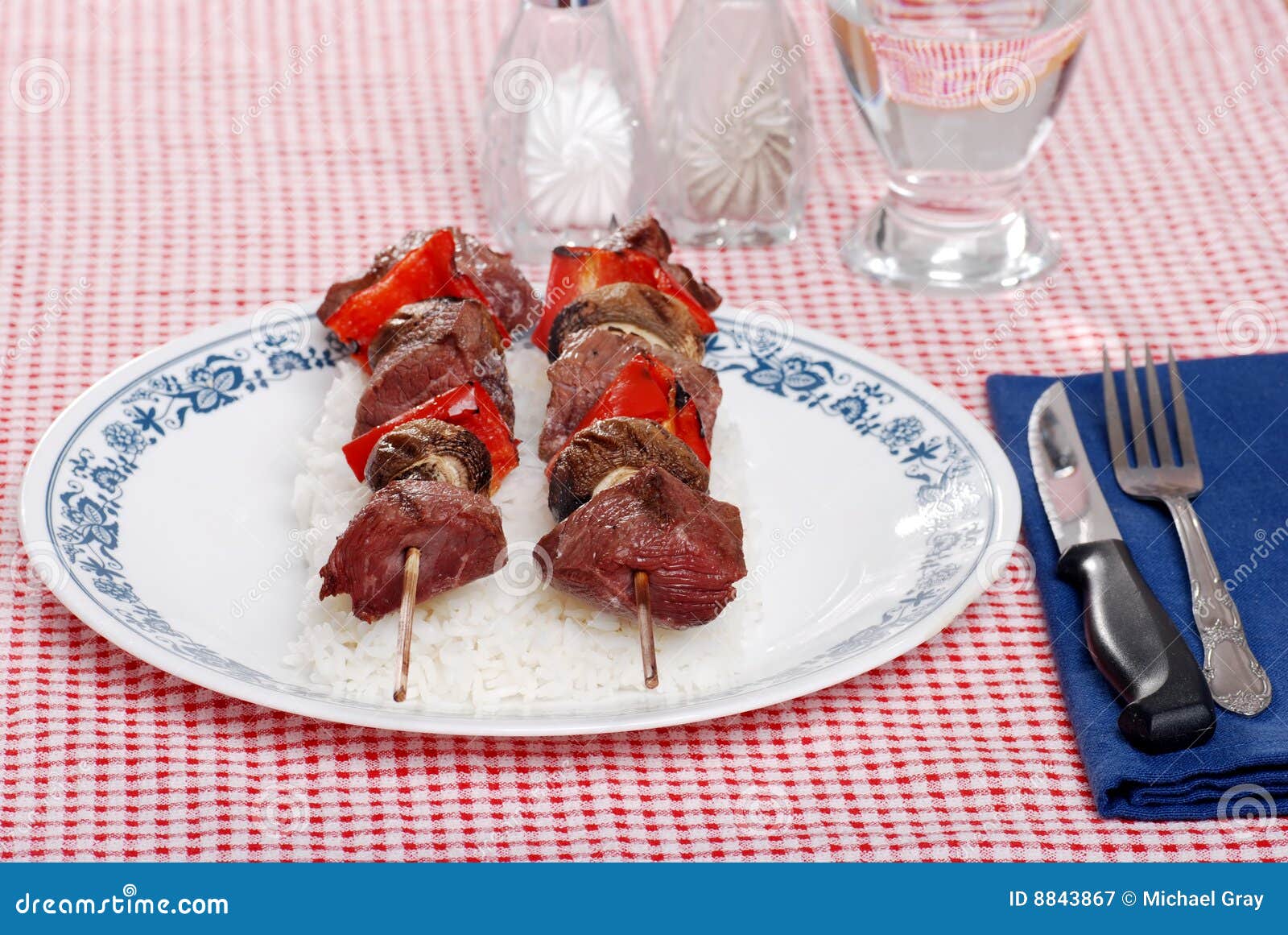 Two Shish Kabobs on a Bed of White Rice Stock Image - Image of meat ...