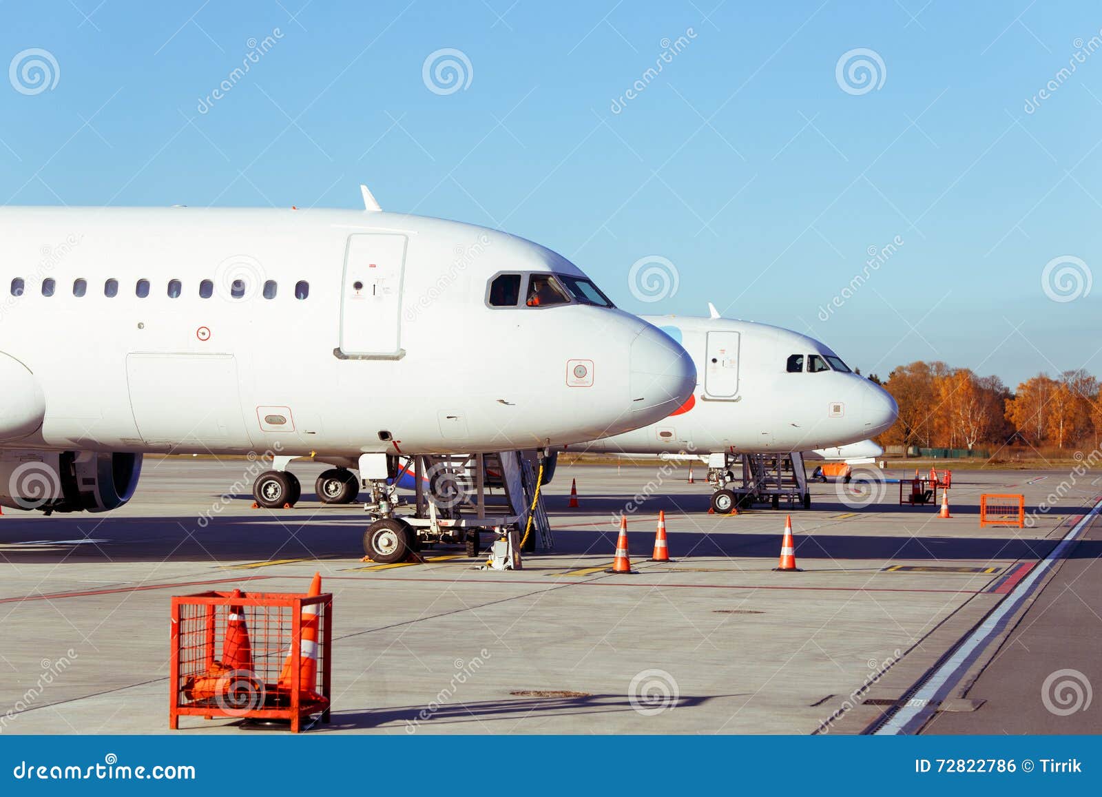 Two Side Profile Parked Airplanes with Windows of Wide-body Airplane ...