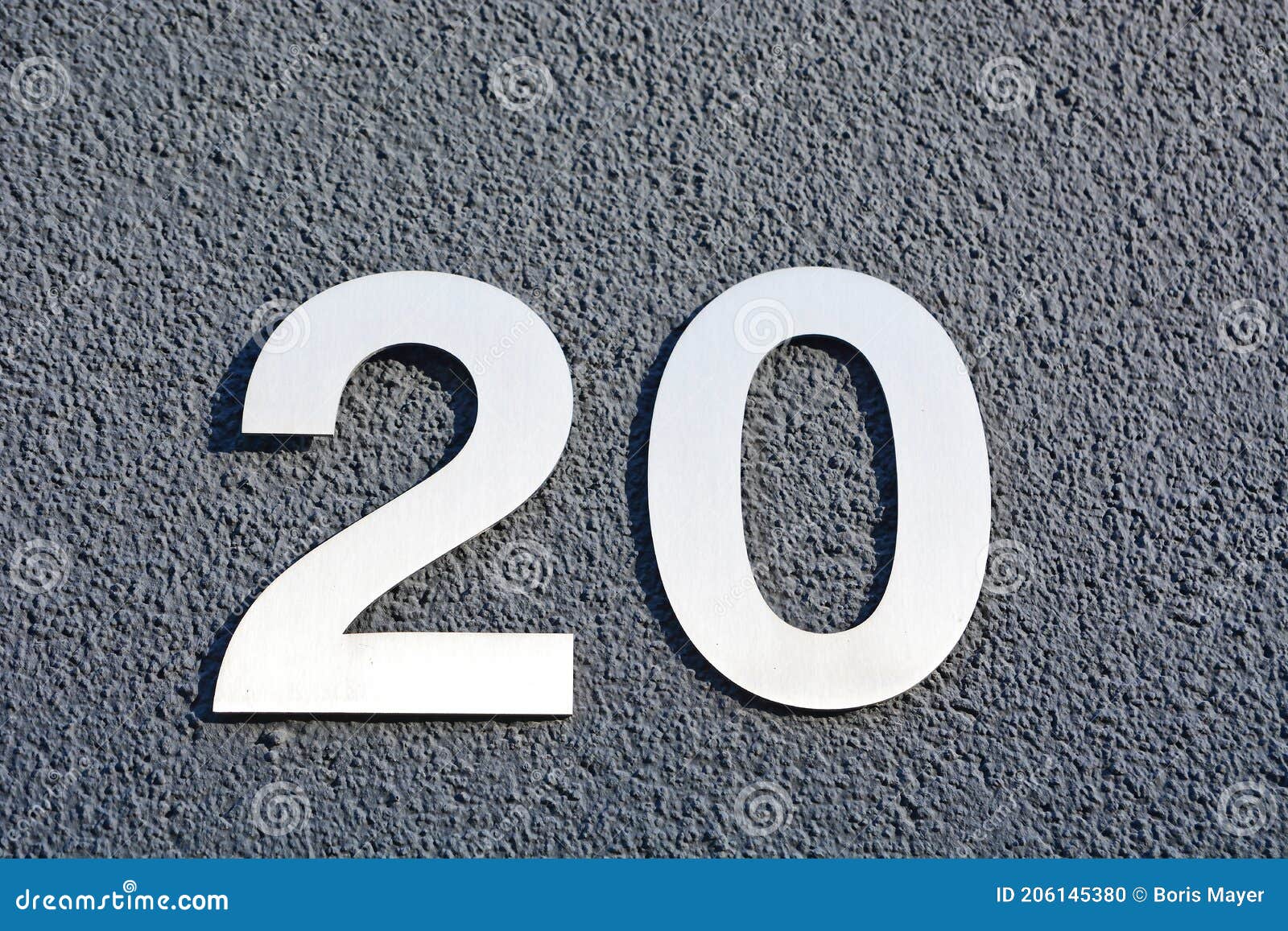 Two Silver Metallic Digits Fixed on a Wall and Showing the Number ...