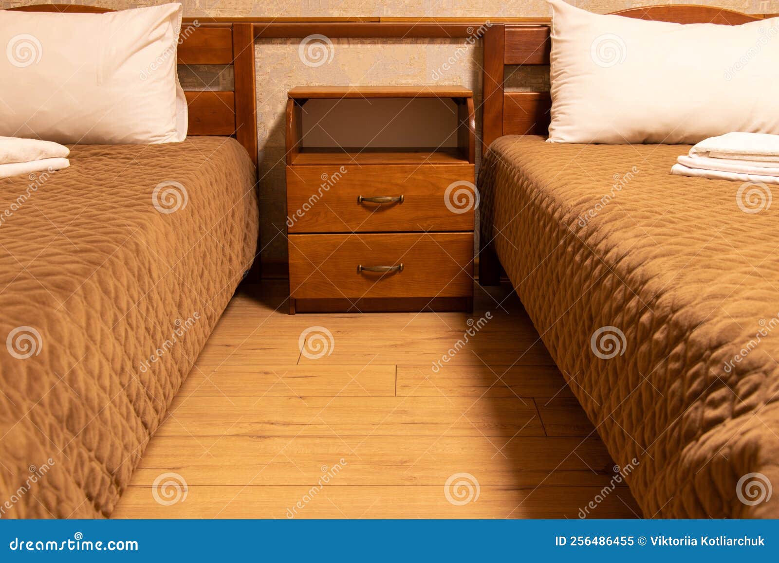 Two Single Beds and a Bedside Table with Drawers in the Bedroom ...