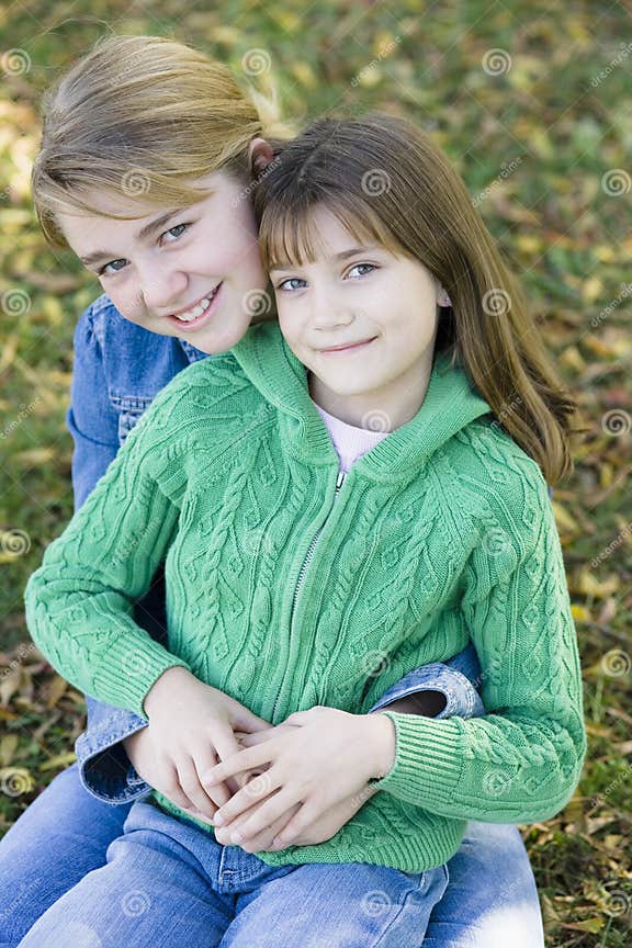 Two Sisters stock photo. Image of blond, holding, embracing - 11897646