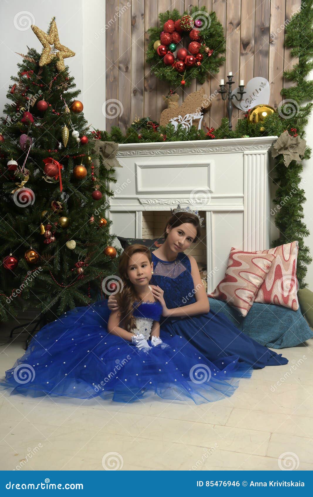 Two Sisters at the Christmas Tree Stock Photo - Image of blue, gift ...