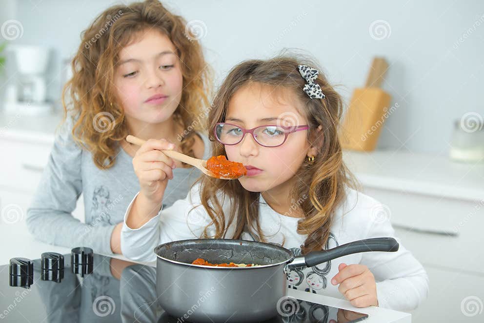 Two Sisters Cooking Together Stock Image - Image of kitchen, childhood ...