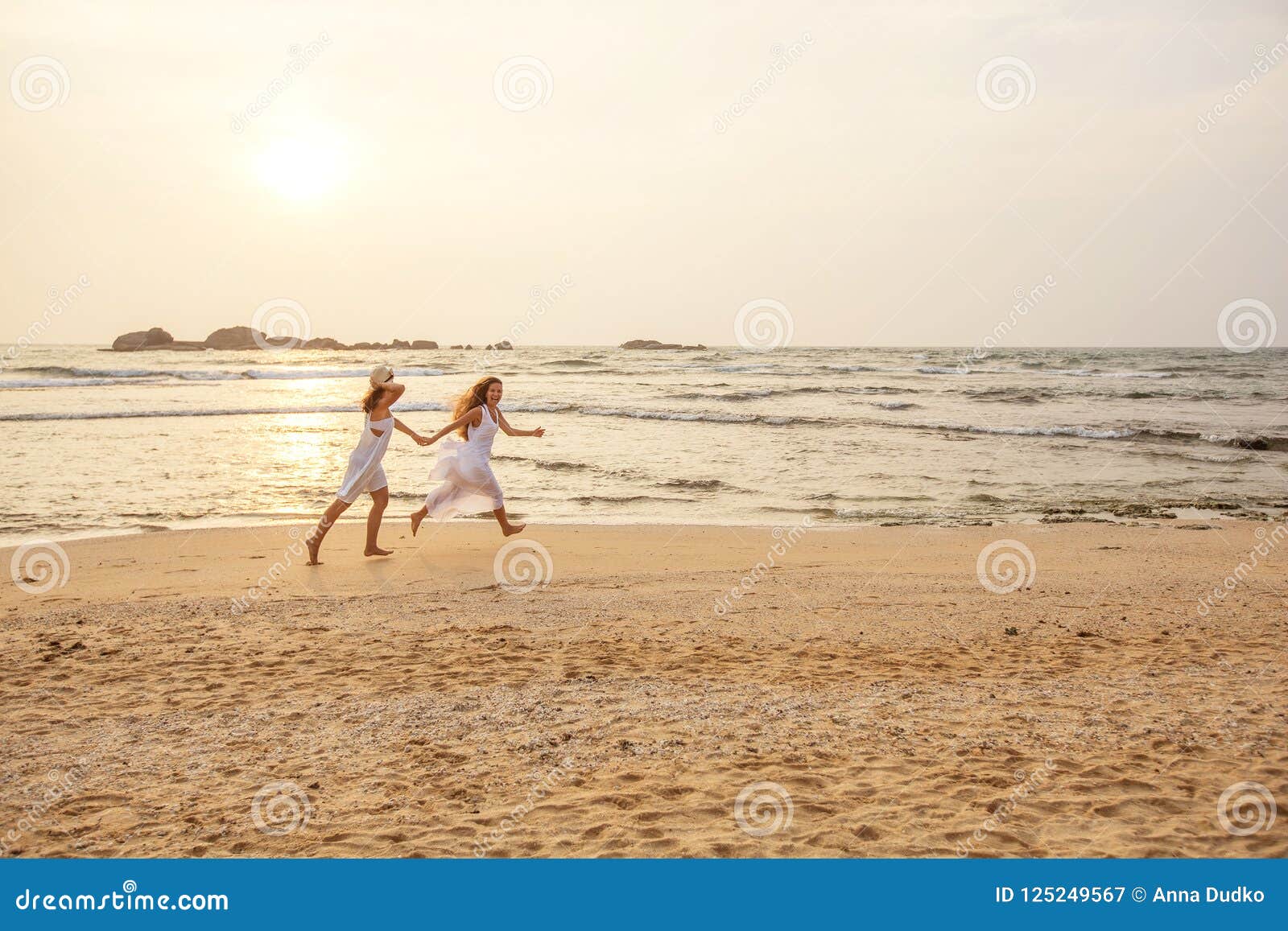 Two Sisters Having Fun at the Sea at the Sunset Stock Image - Image of ...