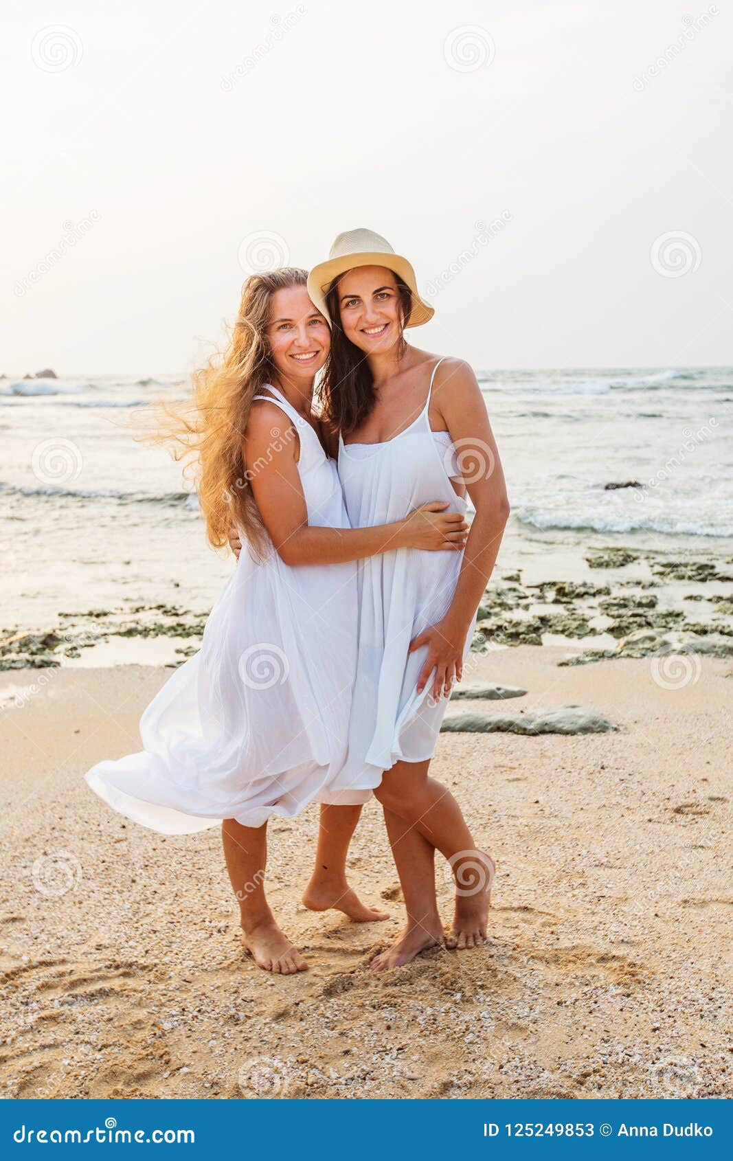 Two Sisters Having Fun at the Sea at the Sunset Stock Image - Image of ...