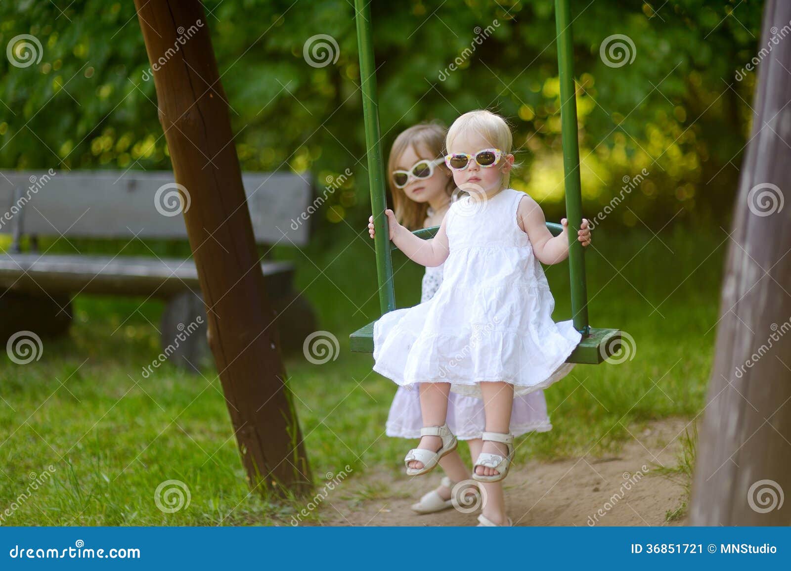 Two Sisters Having Fun on a Swing on Summer Day Stock Image - Image of ...