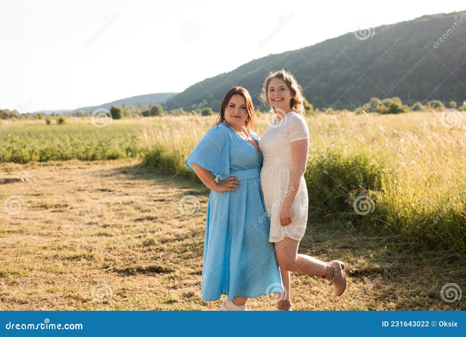 Two Sisters Hugging Each Other at the Farm Stock Photo - Image of green ...