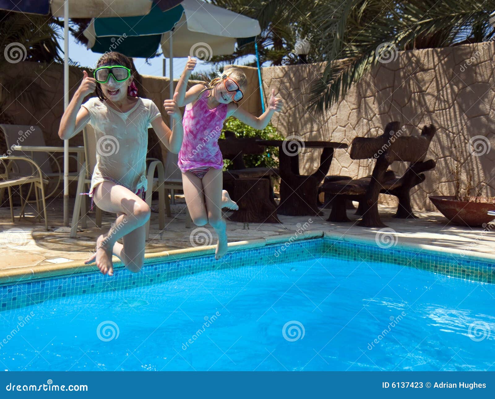 Two Sisters Jumping in the Pool Stock Image - Image of summer, vacation ...