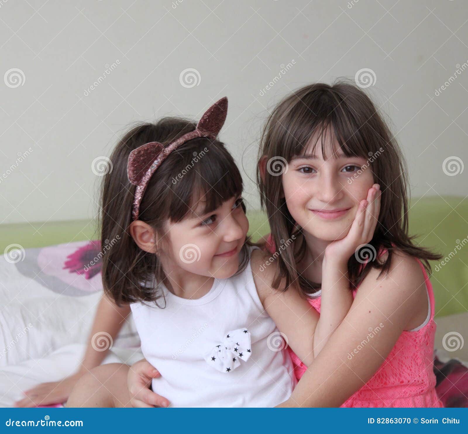 Two sisters stock photo. Image of morning, white, pillow - 82863070