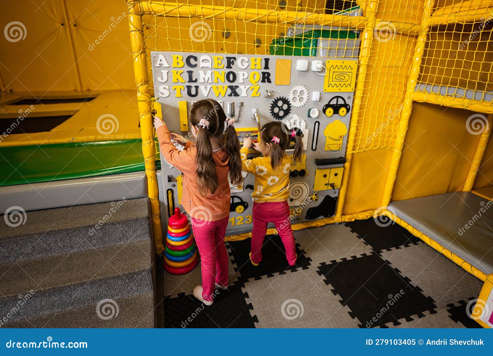 Two Sisters Playing with Busy Board at Kids Play Center Stock Image ...