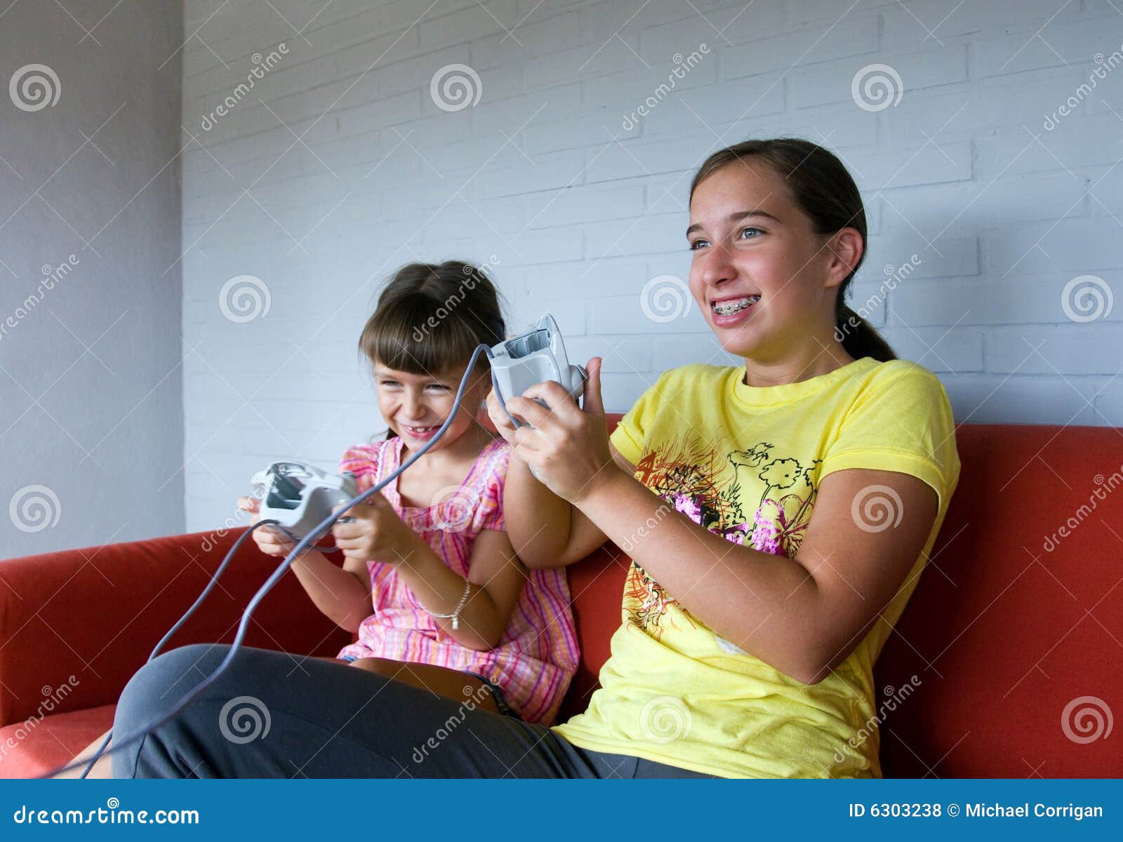 Two Sisters Playing Video Games Stock Photo - Image of video, girls ...