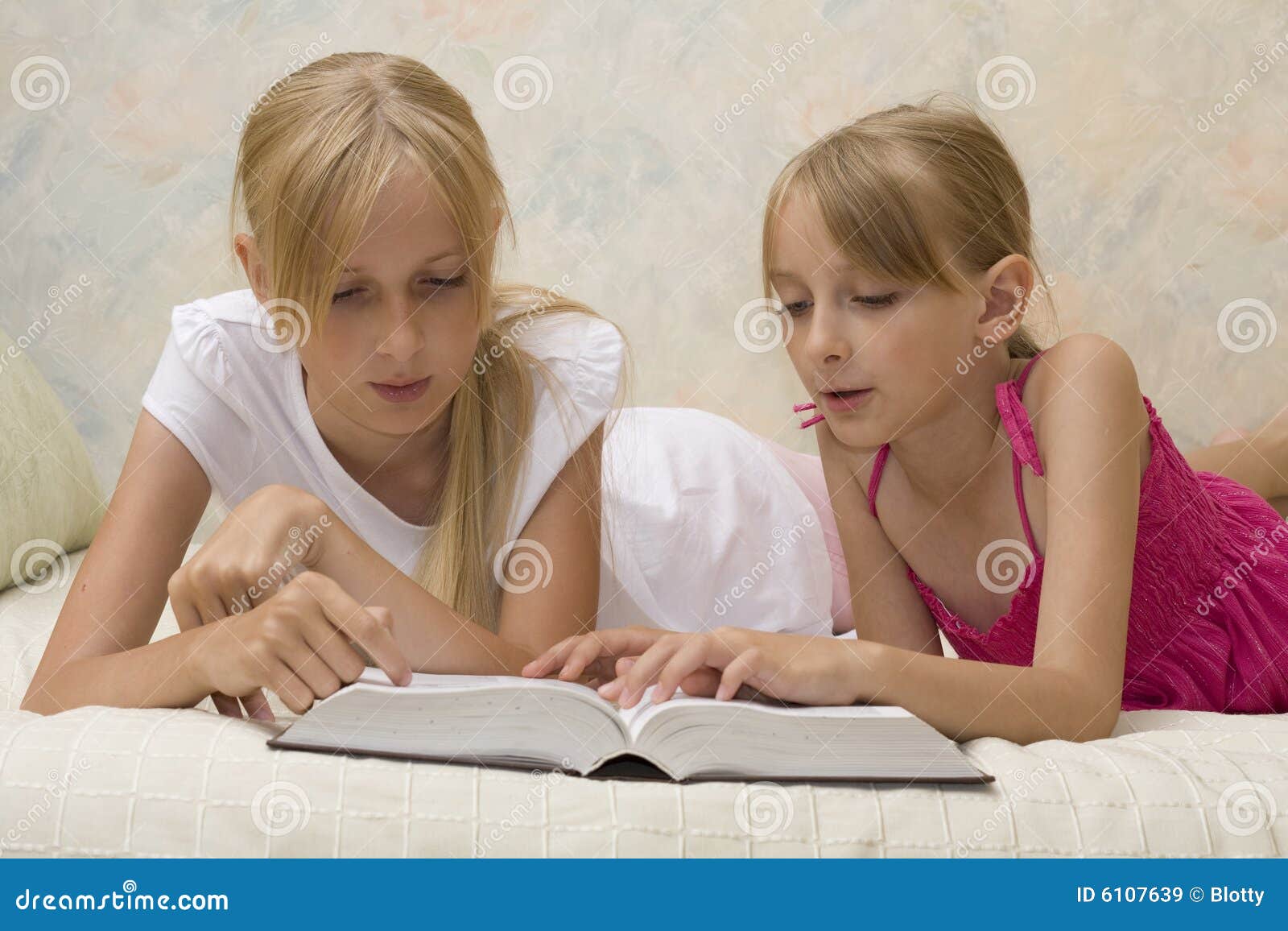 Two sisters reading book stock image. Image of culture - 6107639