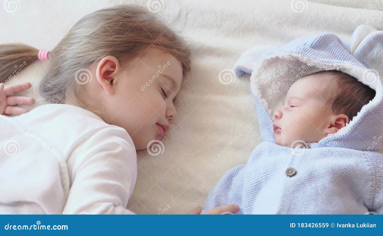 Two Sisters , Babies on the Bed Sleeping. Concept: Sweet Dreams Stock ...