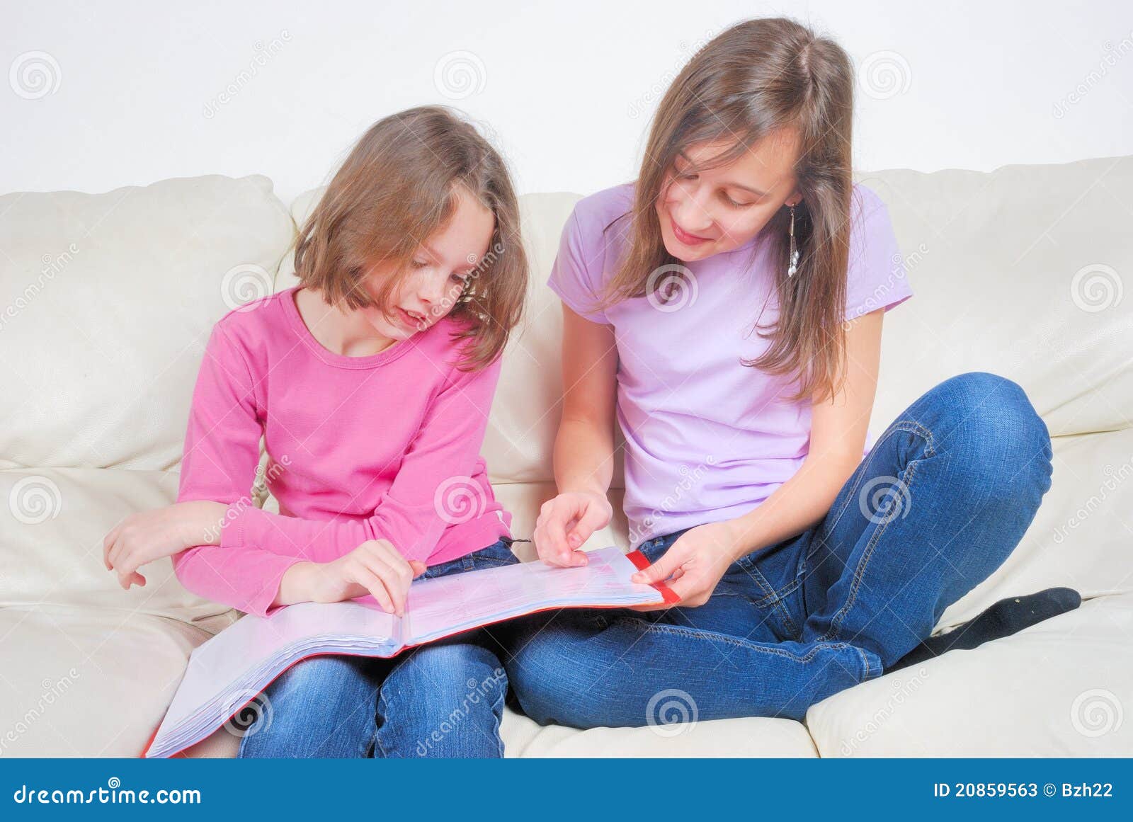 Two Sisters Student on the Couch Stock Image - Image of person, girl ...