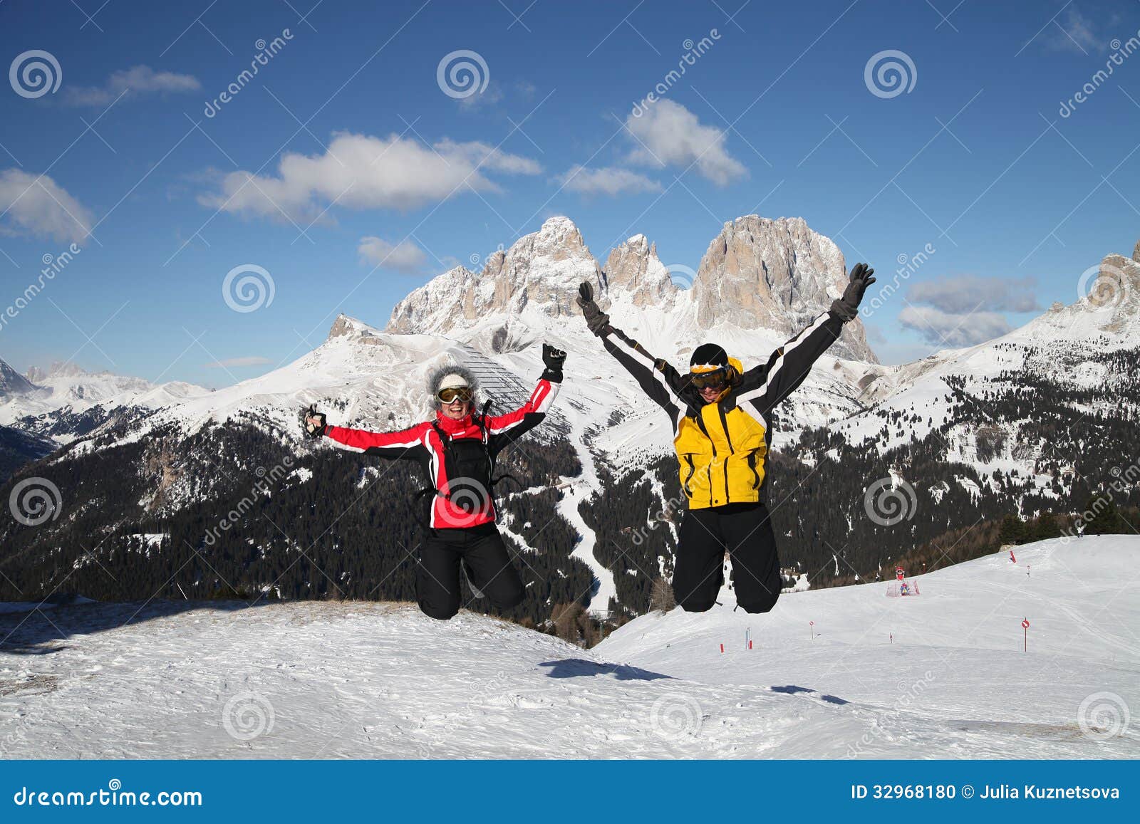 Two Skiers Jump on Top of Mountain Stock Photo - Image of alps, sella ...