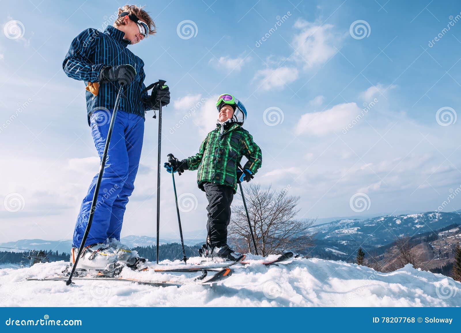 Two Skiers on the Top of Snow Hill Ready To Slow Down Stock Photo ...