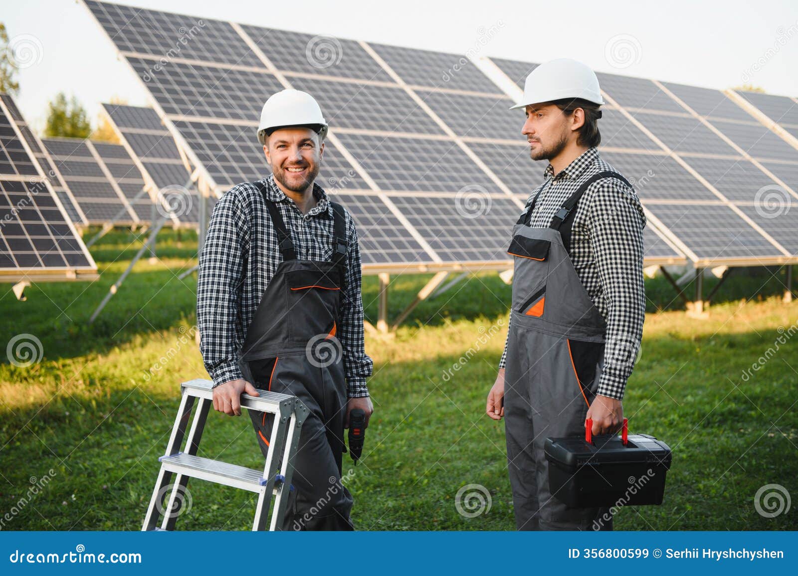 Two Skilled Workers or Craftsmen Wearing Working Gray Uniforms ...