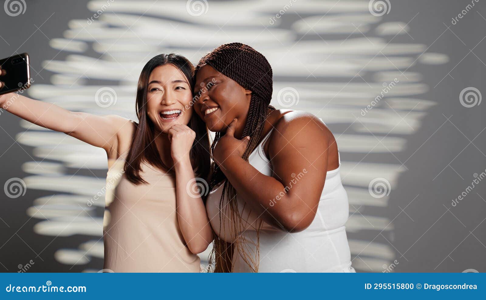 Two Skincare Models Taking Pictures on Smartphone Stock Photo - Image ...