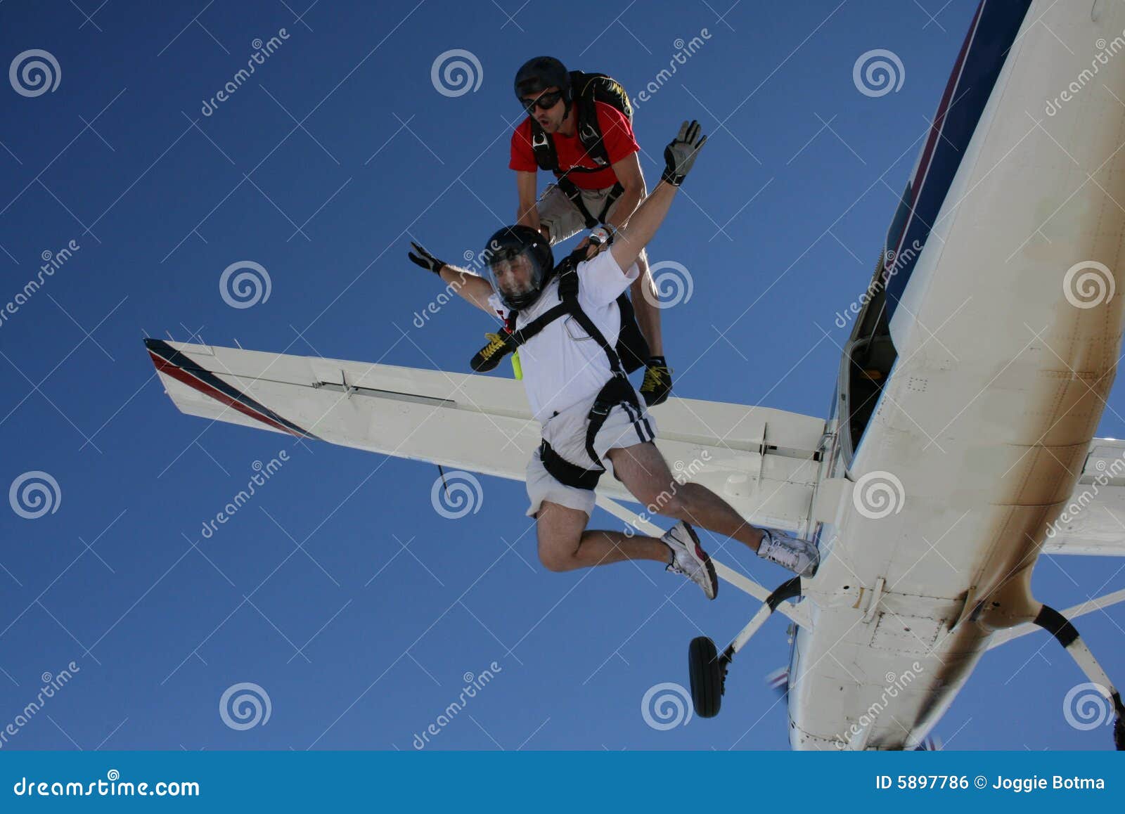 Two Skydivers Exit an Airplane Stock Photo - Image of diving, group ...