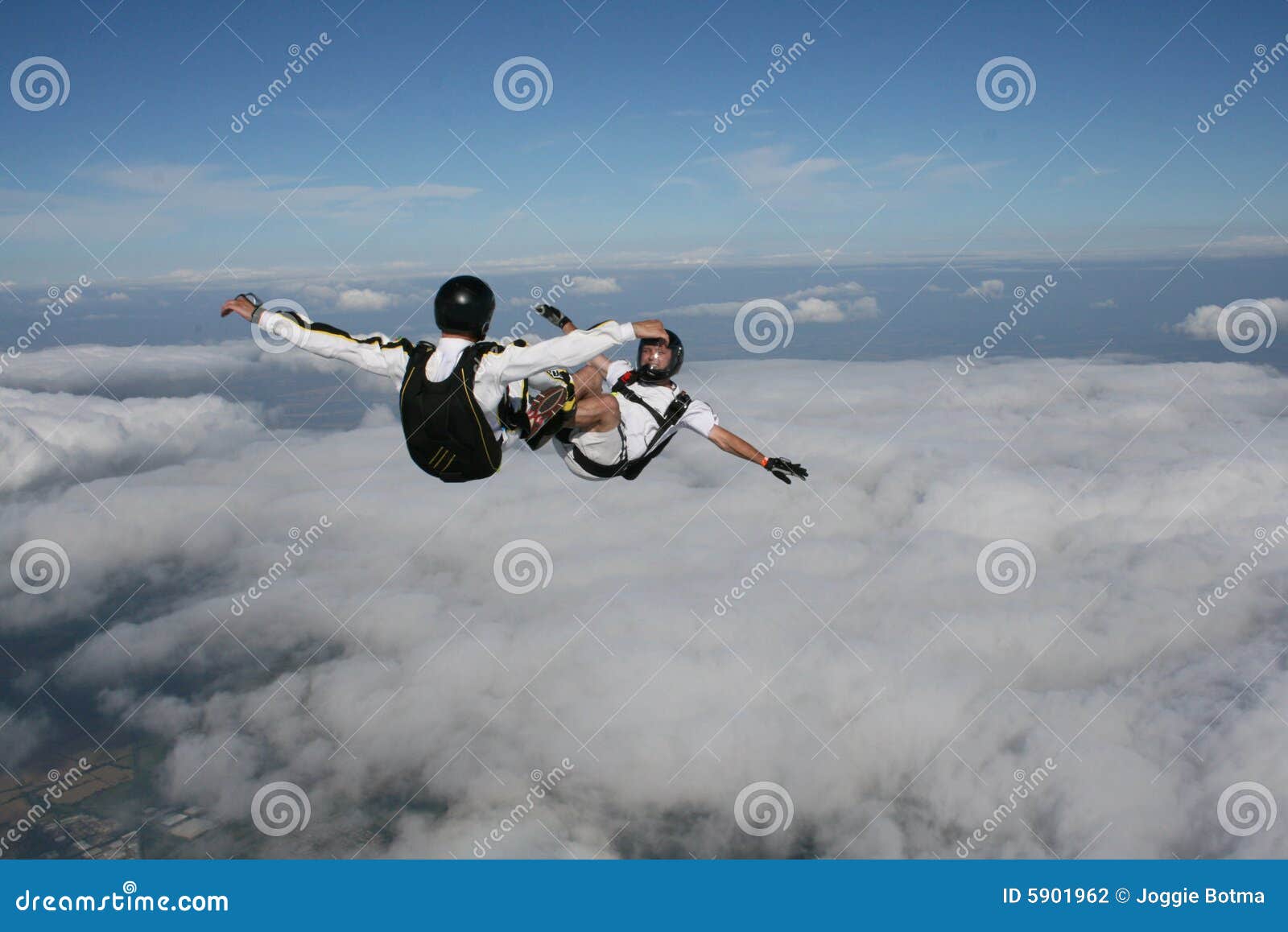 Two Skydivers in a Sit Position while in Freefall Stock Photo - Image ...