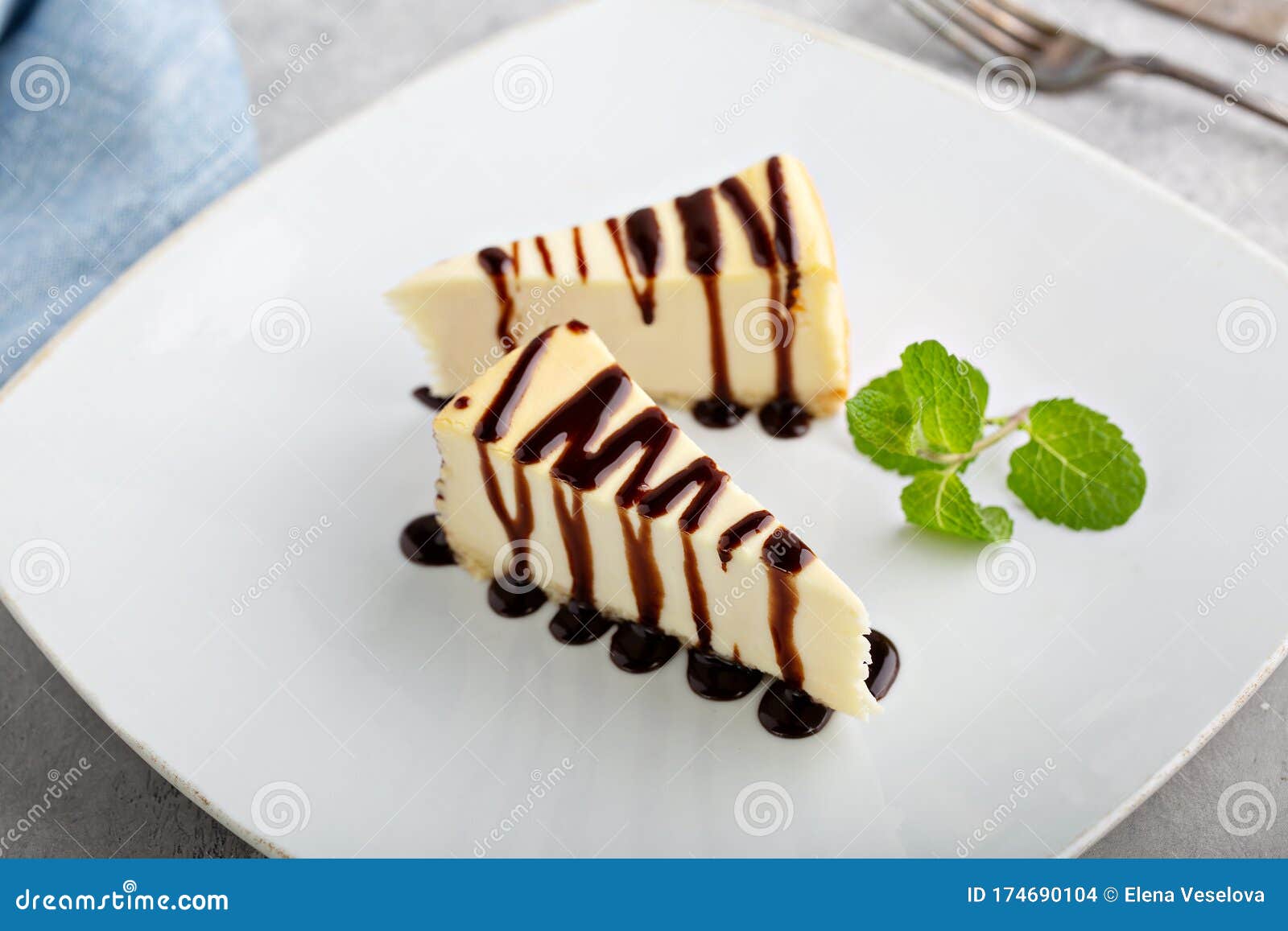 Two Slices of Cheesecake with Chocolate Sauce Stock Photo - Image of ...