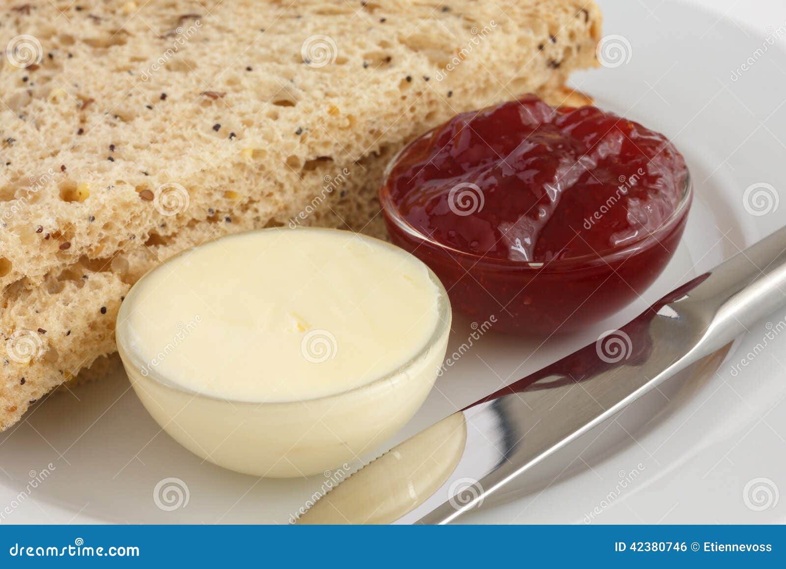 Two Slices of Multigrain Bread with Jam and Butter Stock Photo - Image ...
