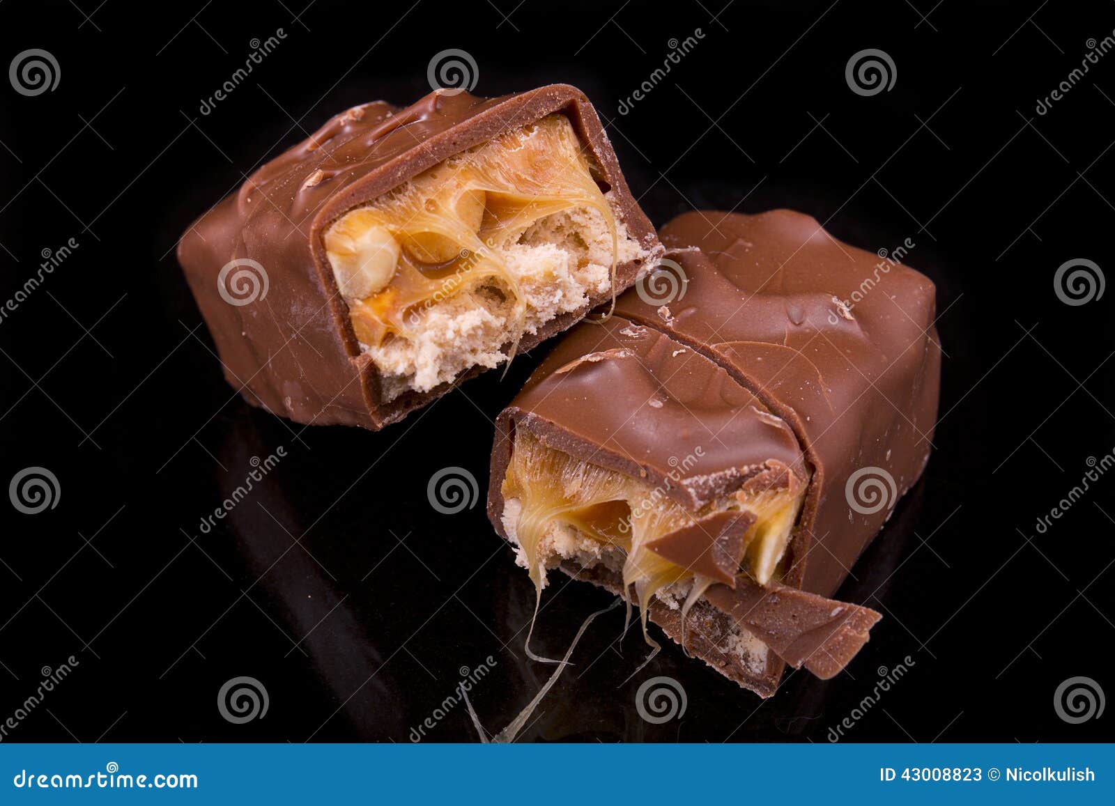 Two Slices of Snickers Bars on a Black Macro Stock Image - Image of ...