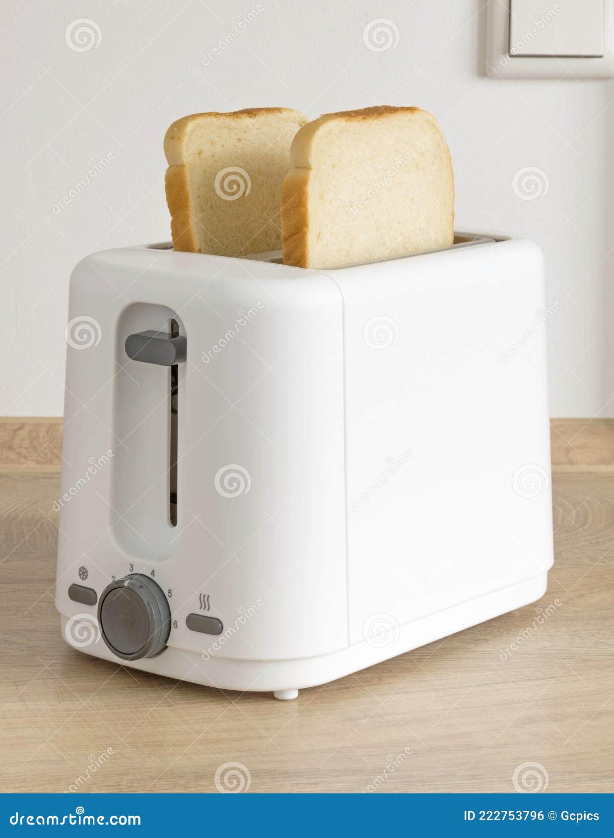 Two Slices of White Bread Ready for Toasting in an Electrical Toaster ...