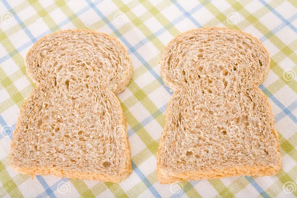 Two Slices of Wholemeal Bread Placed on Cloth Stock Image - Image of ...