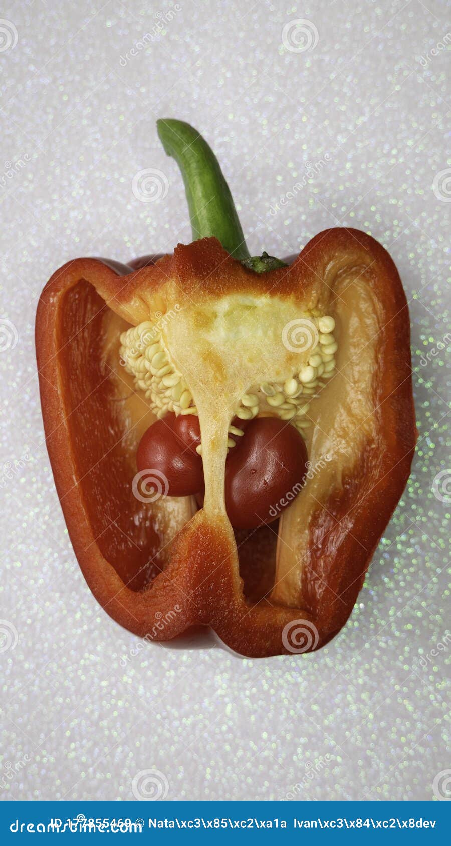 Two Small Bell Peppers Growing Inside a Red One, White Glitter Backdrop ...