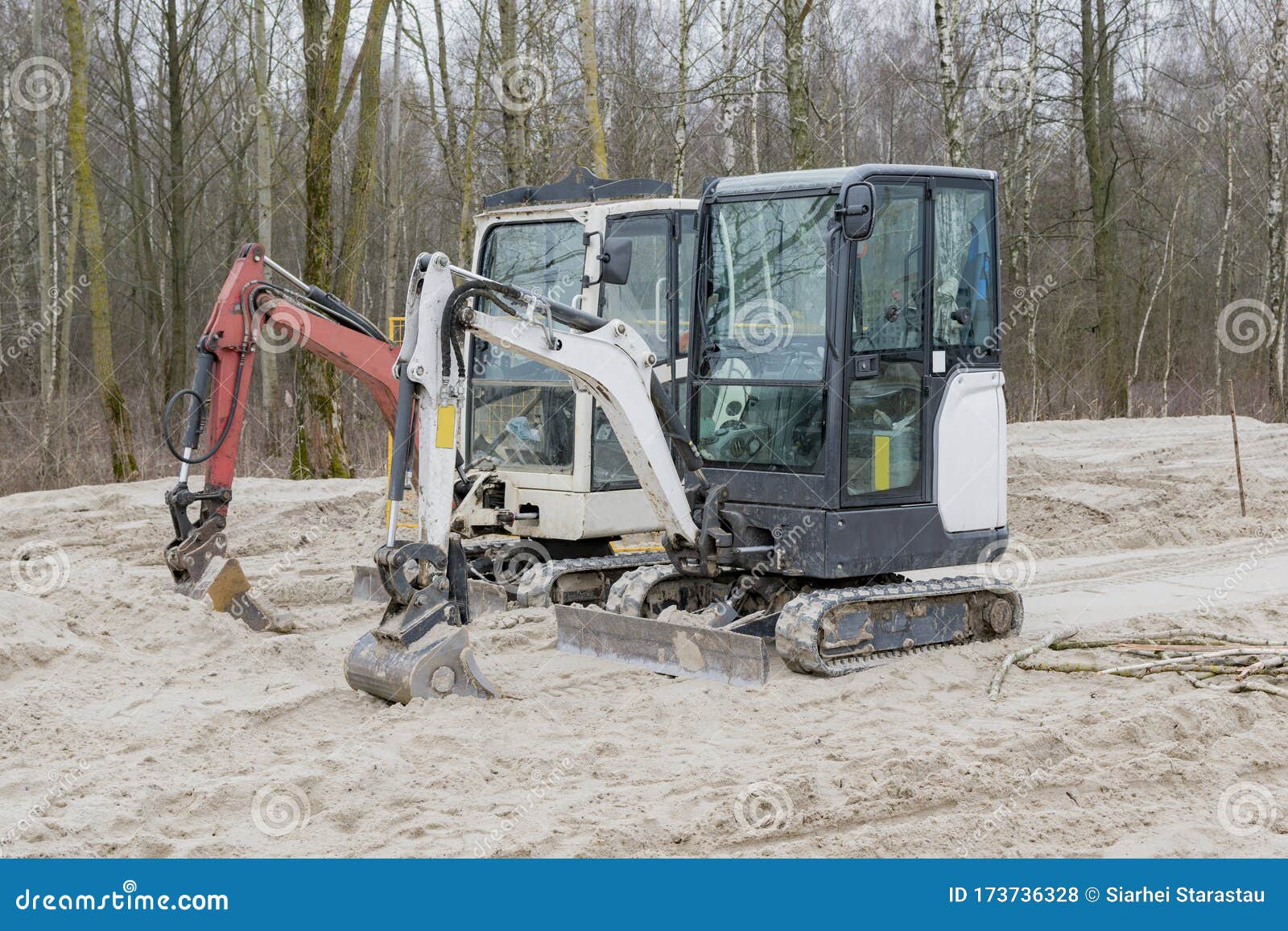 Two small crawler tractors stock photo. Image of build - 173736328