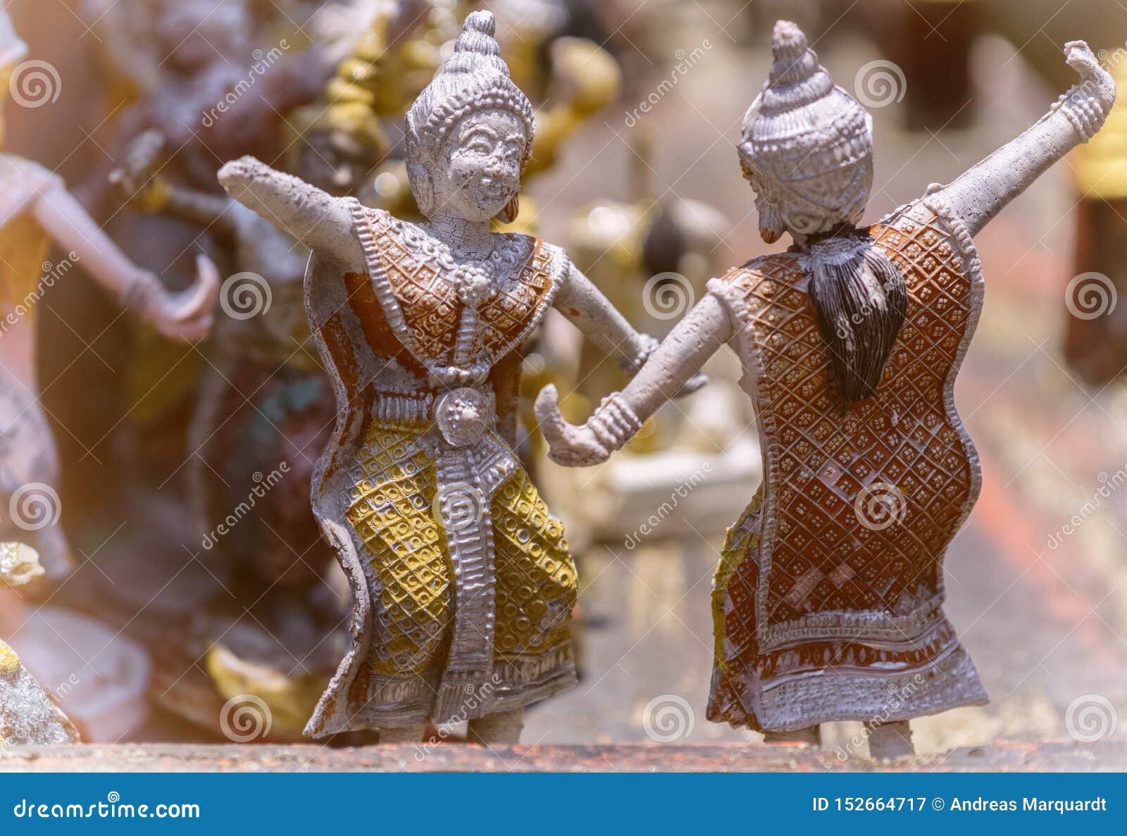 Two small,dancing statues stock image. Image of creativity - 152664717