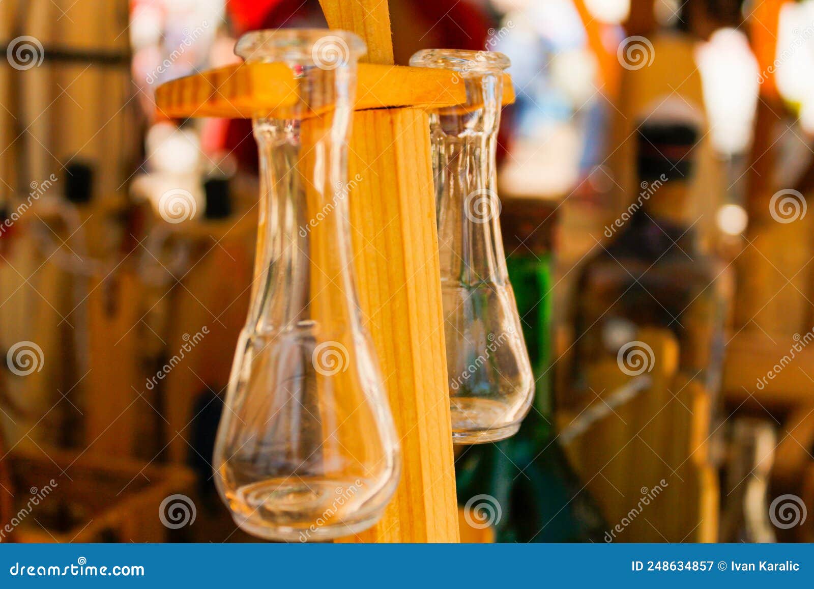 Two Small Glass Bottles for Alcoholic Drinks on Wooden Rack Stock Image ...