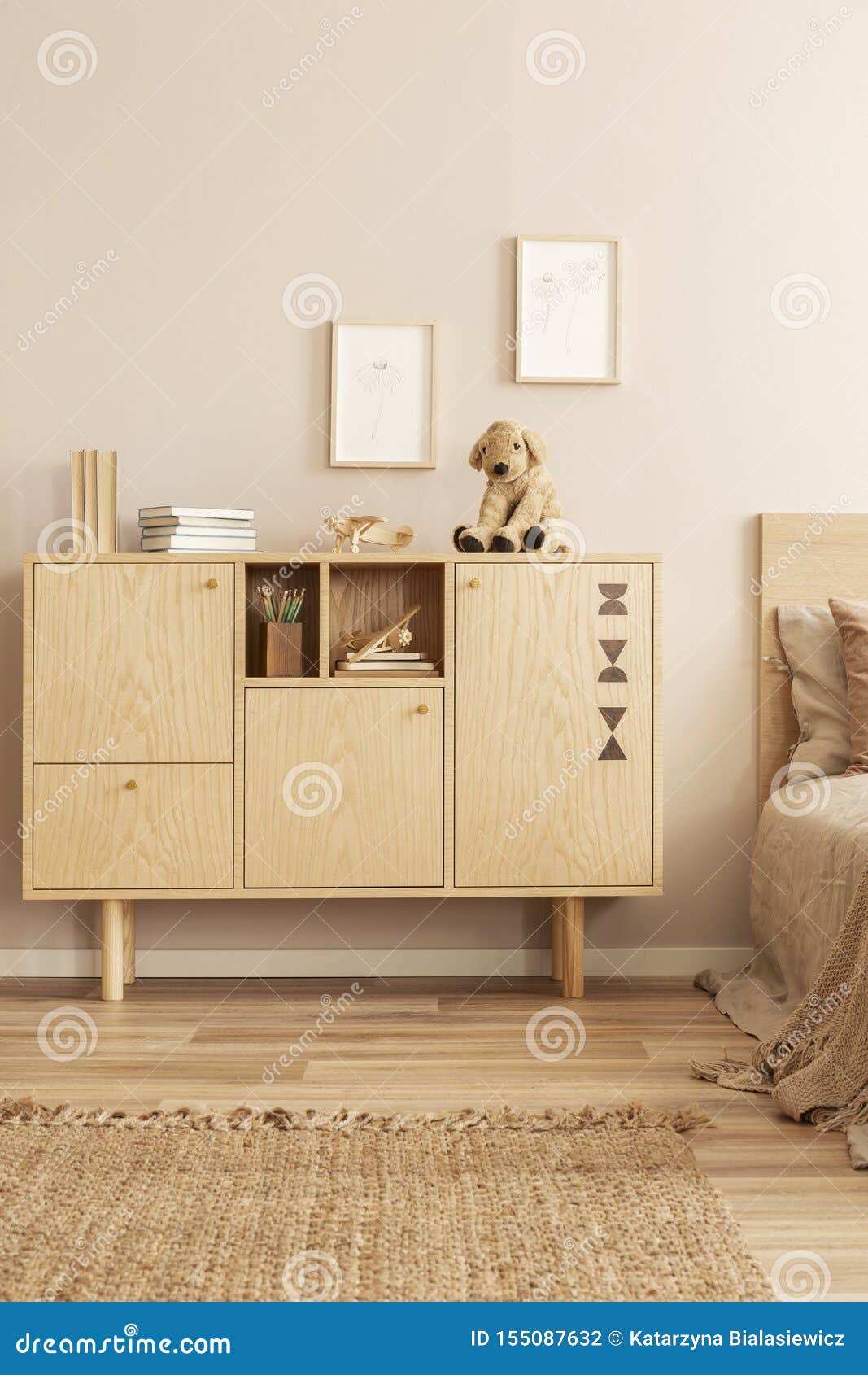 Two Small Graphics in Wooden Frames on Empty Wall of Stylish Interior ...