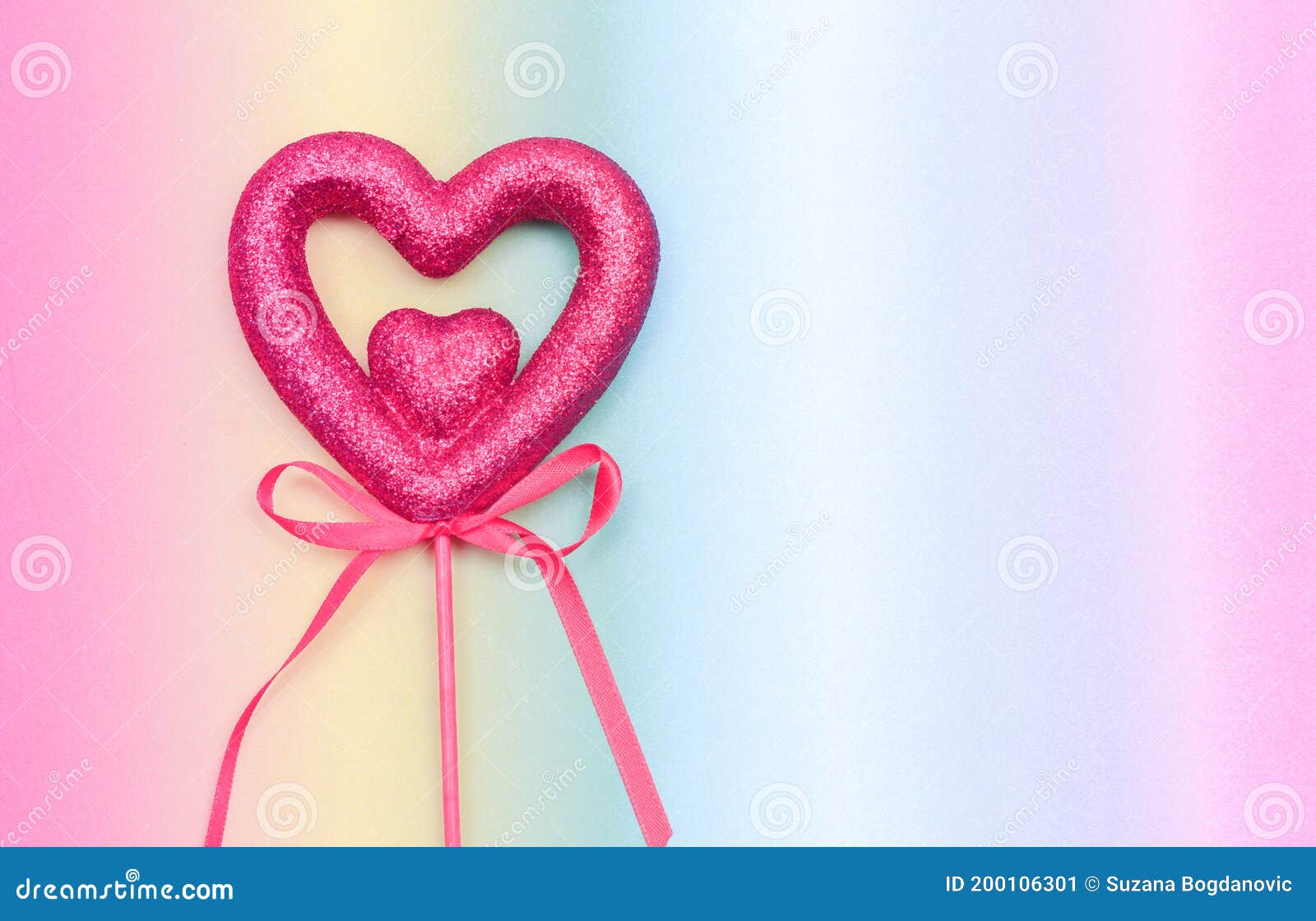 Two Small Hearts on a Pink Stick and a Pink Ribbon with a Rainbow ...