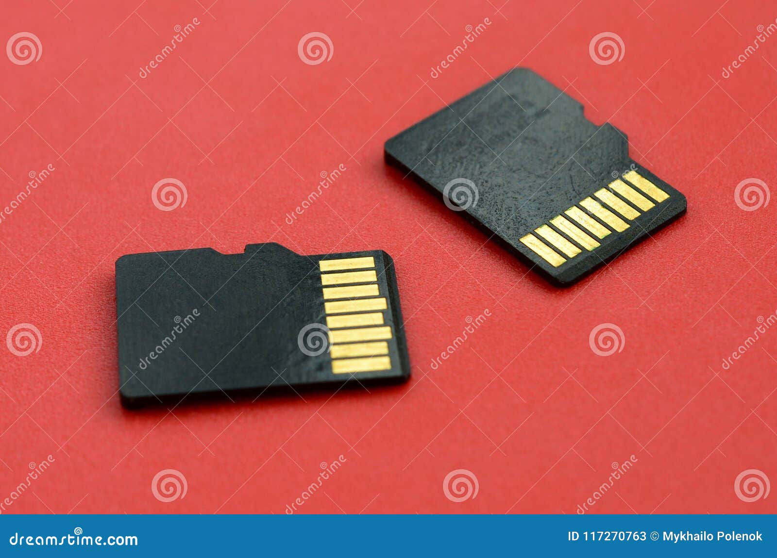 Two Small Micro SD Memory Cards Lie on a Red Background. a Small and ...