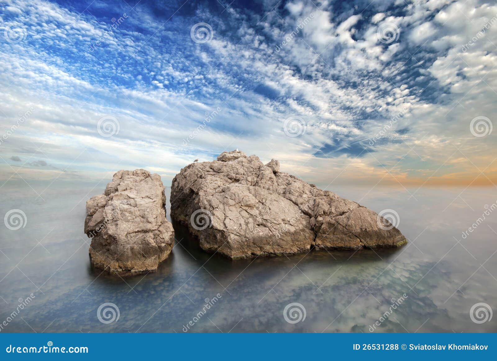 Two small rock in the sea stock photo. Image of dusk - 26531288