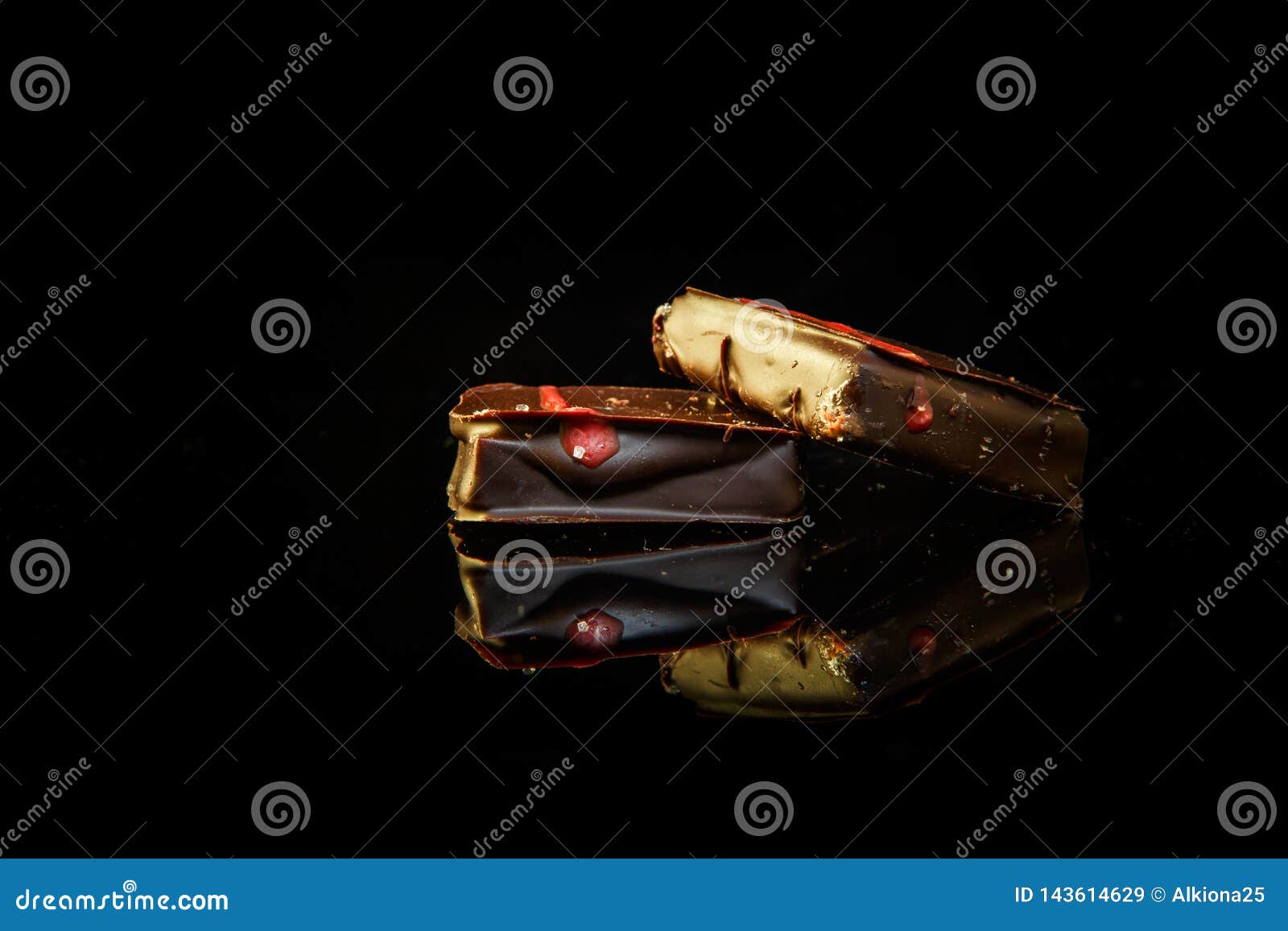 Two Small Square Chocolate Candies on Black Background Stock Image ...
