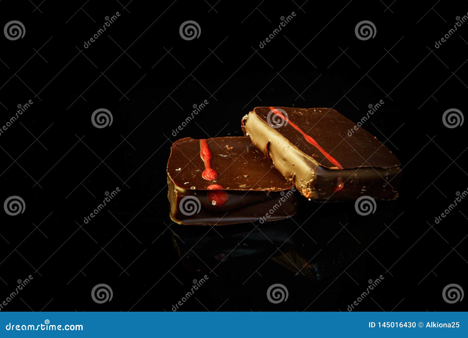 Two Small Square Chocolate Candies on Black Background Stock Photo ...