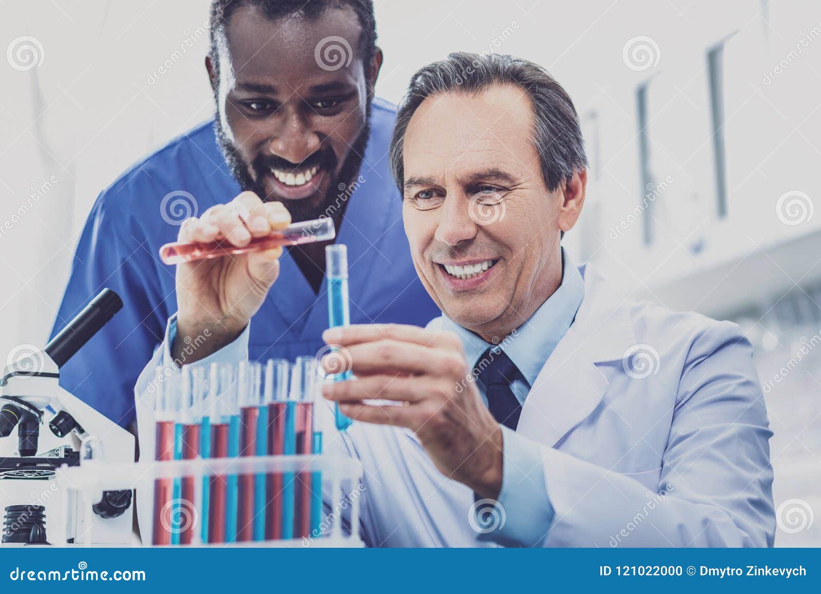 Two Smart Bioengineers Studying Genetic Code Together Stock Photo ...