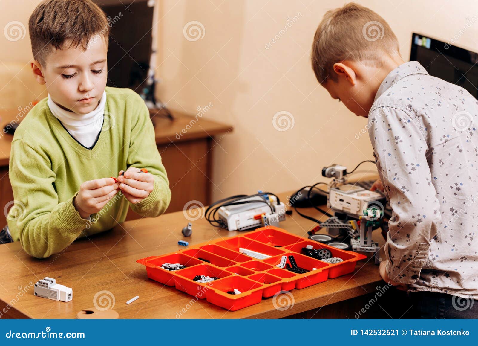 Two Smart Boys are Making Robots from the Robotic Constructor at the ...