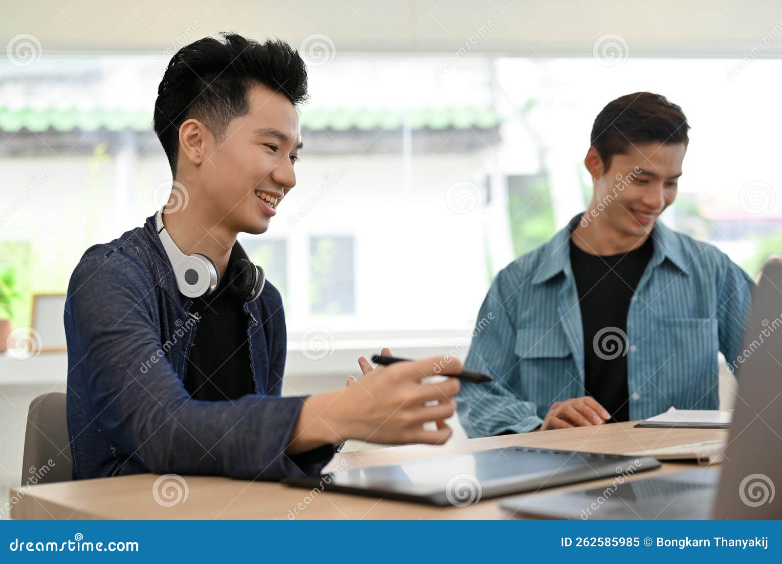 Two Smart Millennial Asian Male Web Developers Discussing and Working ...