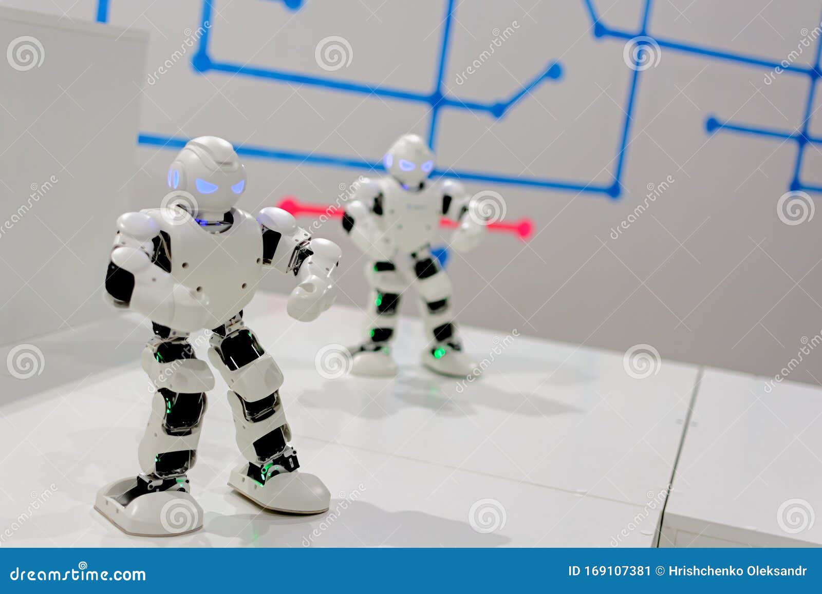 Two Smart Robot Dancing. Focus on Near the Robot Stock Image - Image of ...