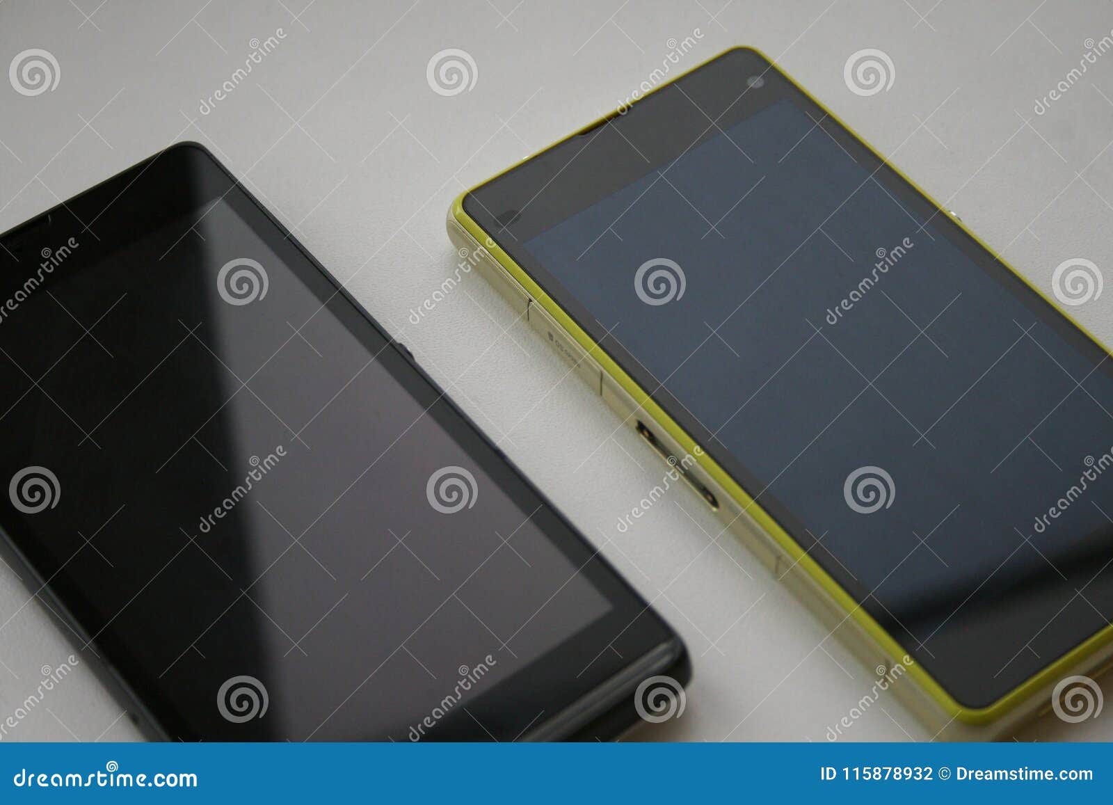 Two Smartphones on the Table Stock Photo - Image of display ...