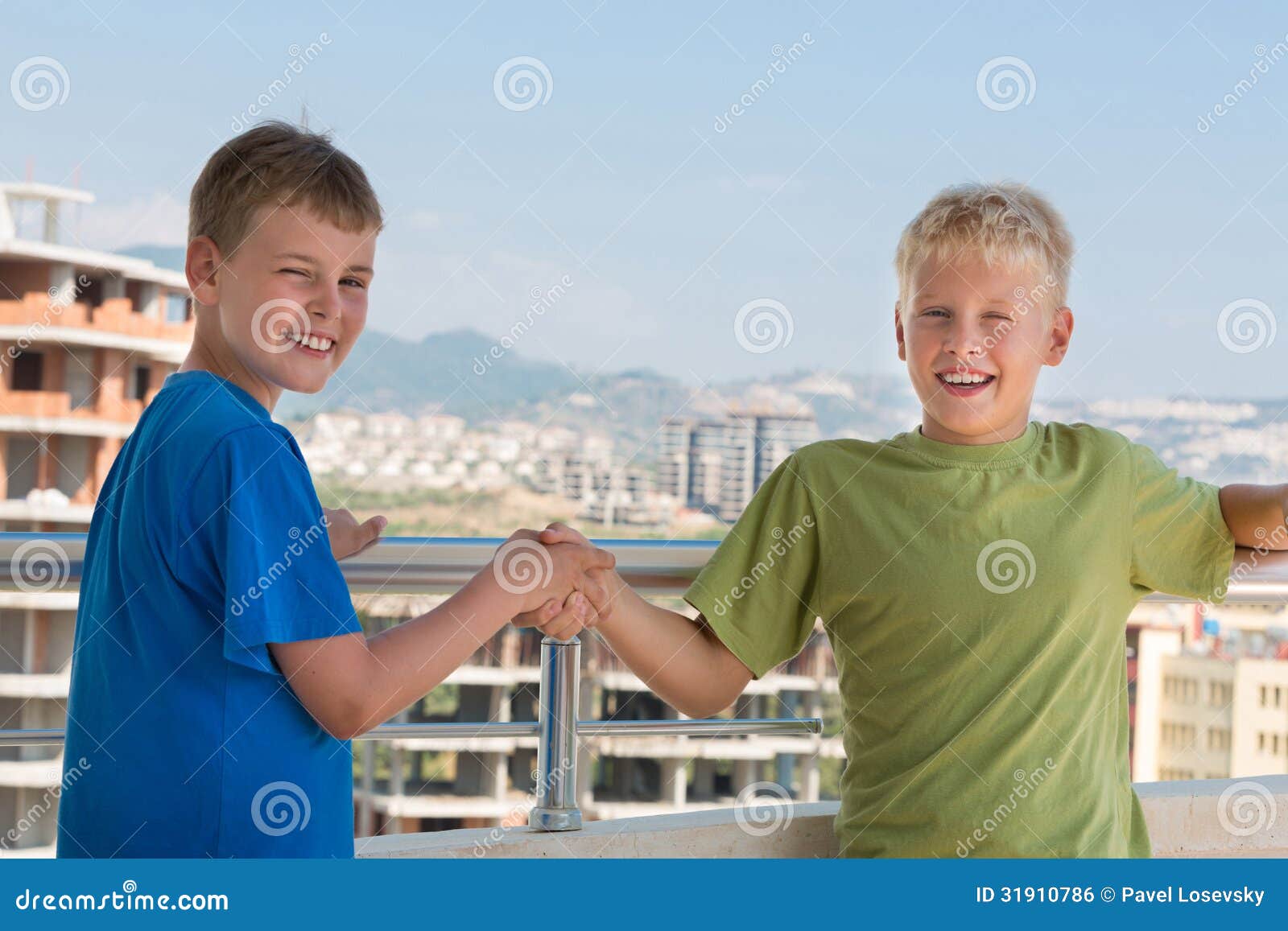 Two Smiling Boys in T-shirts are Shake Hands Stock Photo - Image of ...